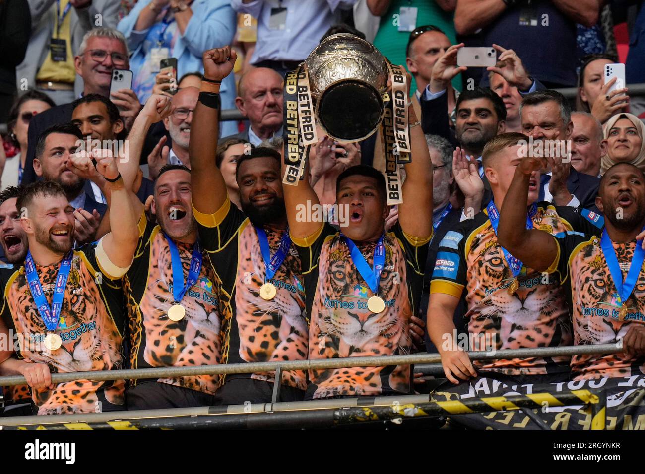 John Asiata #13 of Leigh Leopards lifts the BetFred Challenge Cup ...