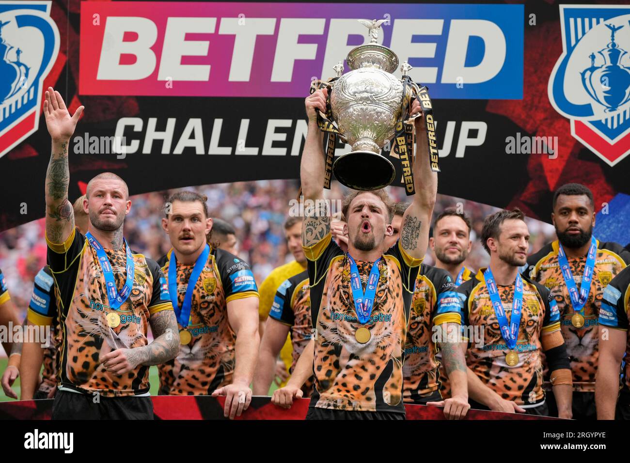 Ed Chamberlain #3 of Leigh Leopards lifts the BetFred Challenge Cup ...