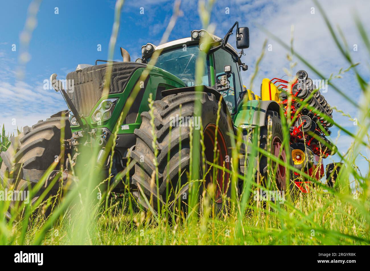 Creative agricultural landscape. Low angle view through grass to ...