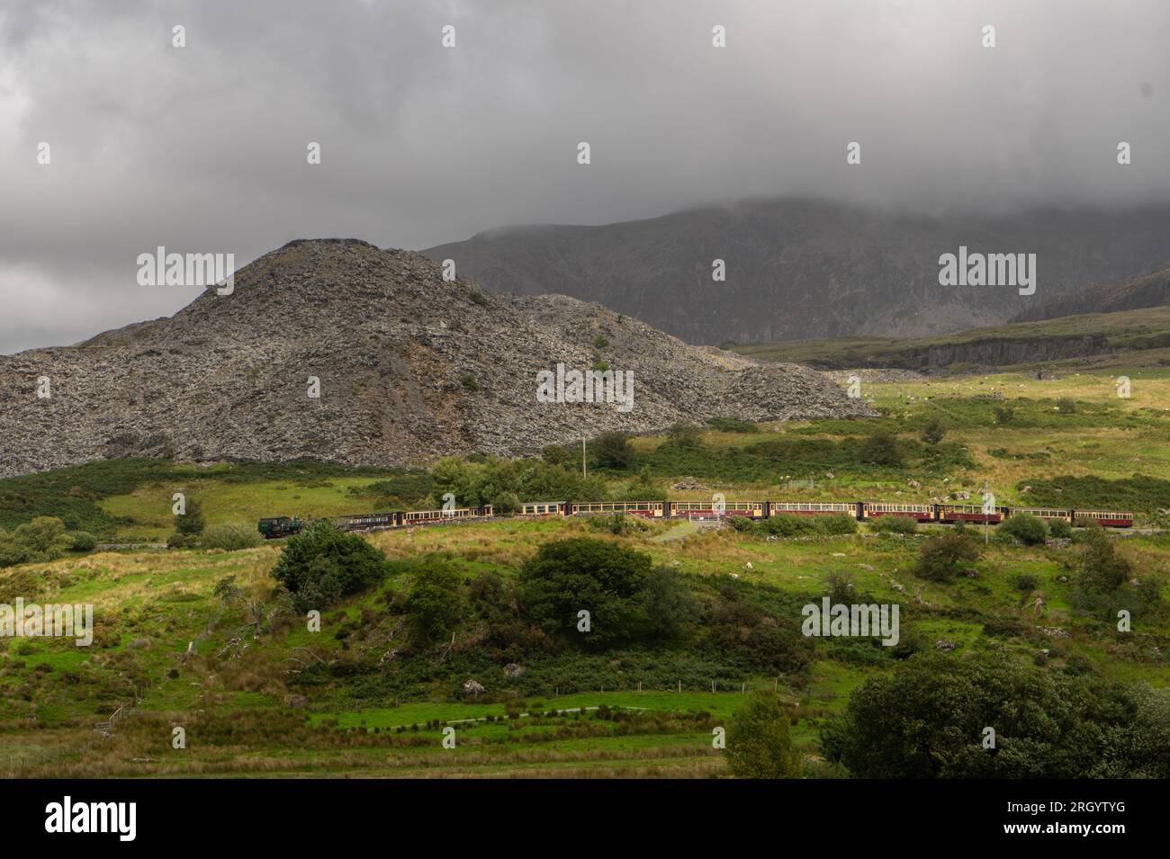 Tourist railway and farm under Mount Snowdon at Snowdonia National Park ...