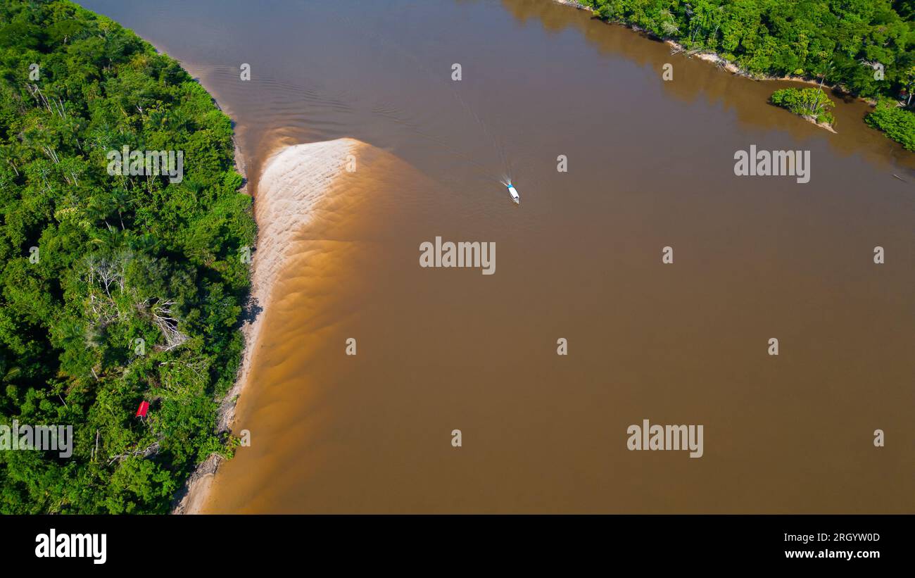 The Amazon rivers in the summer season present white sand beaches ...