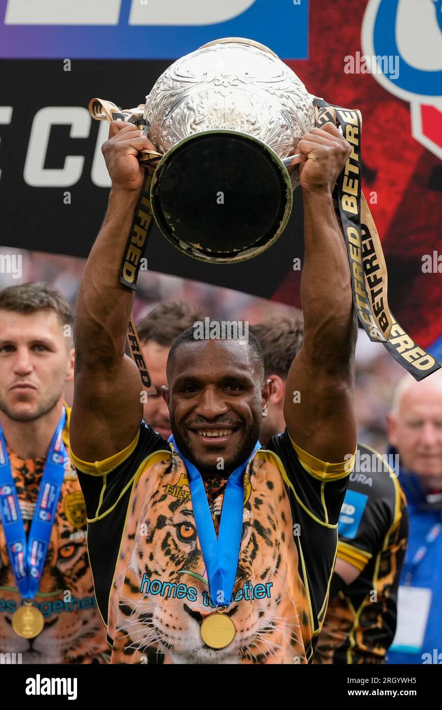 Edwin Ipape #9 of Leigh Leopards lifts the BetFred Challenge Cup trophy ...