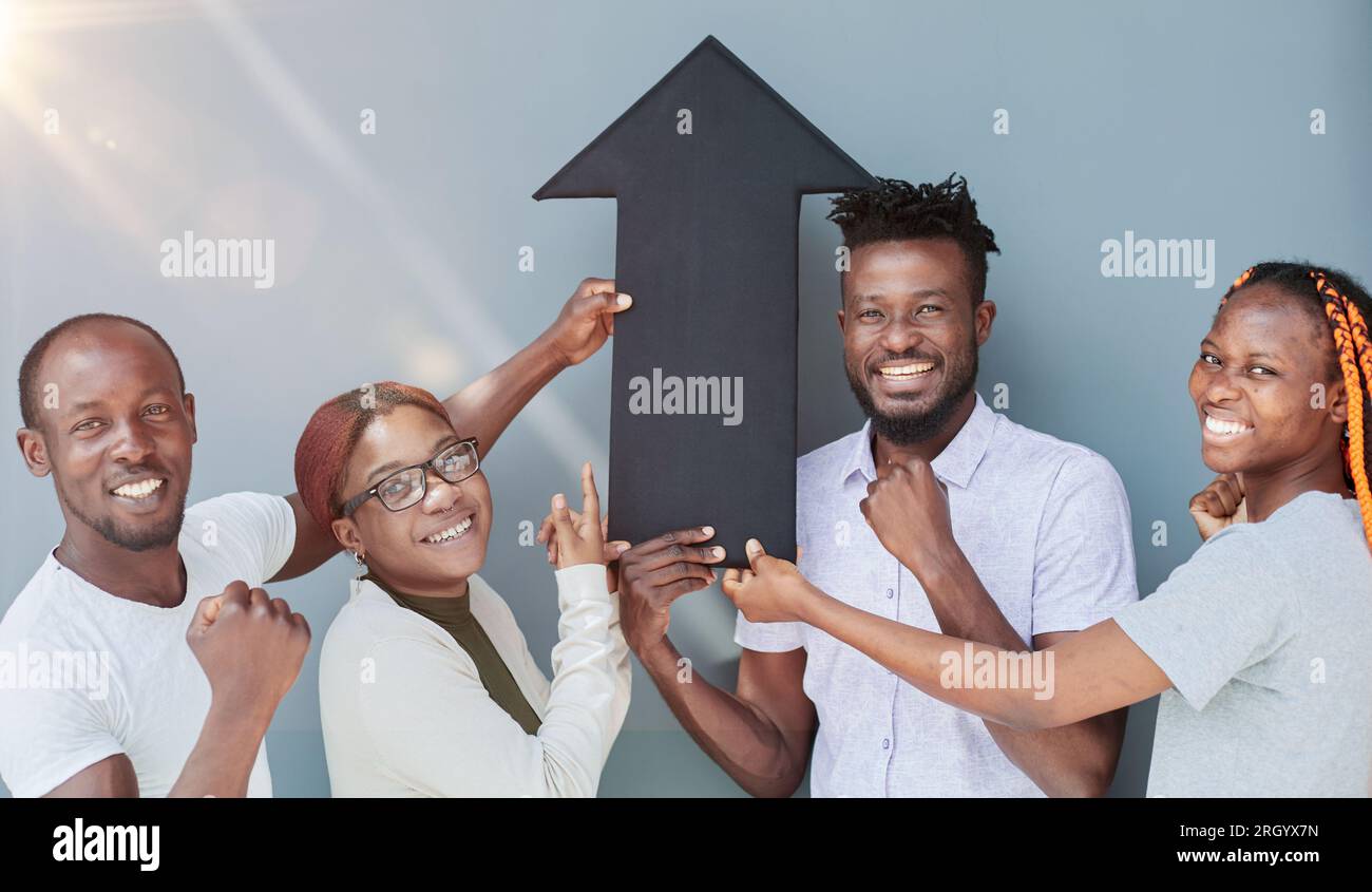 Business Team Holding black arrow together Stock Photo - Alamy