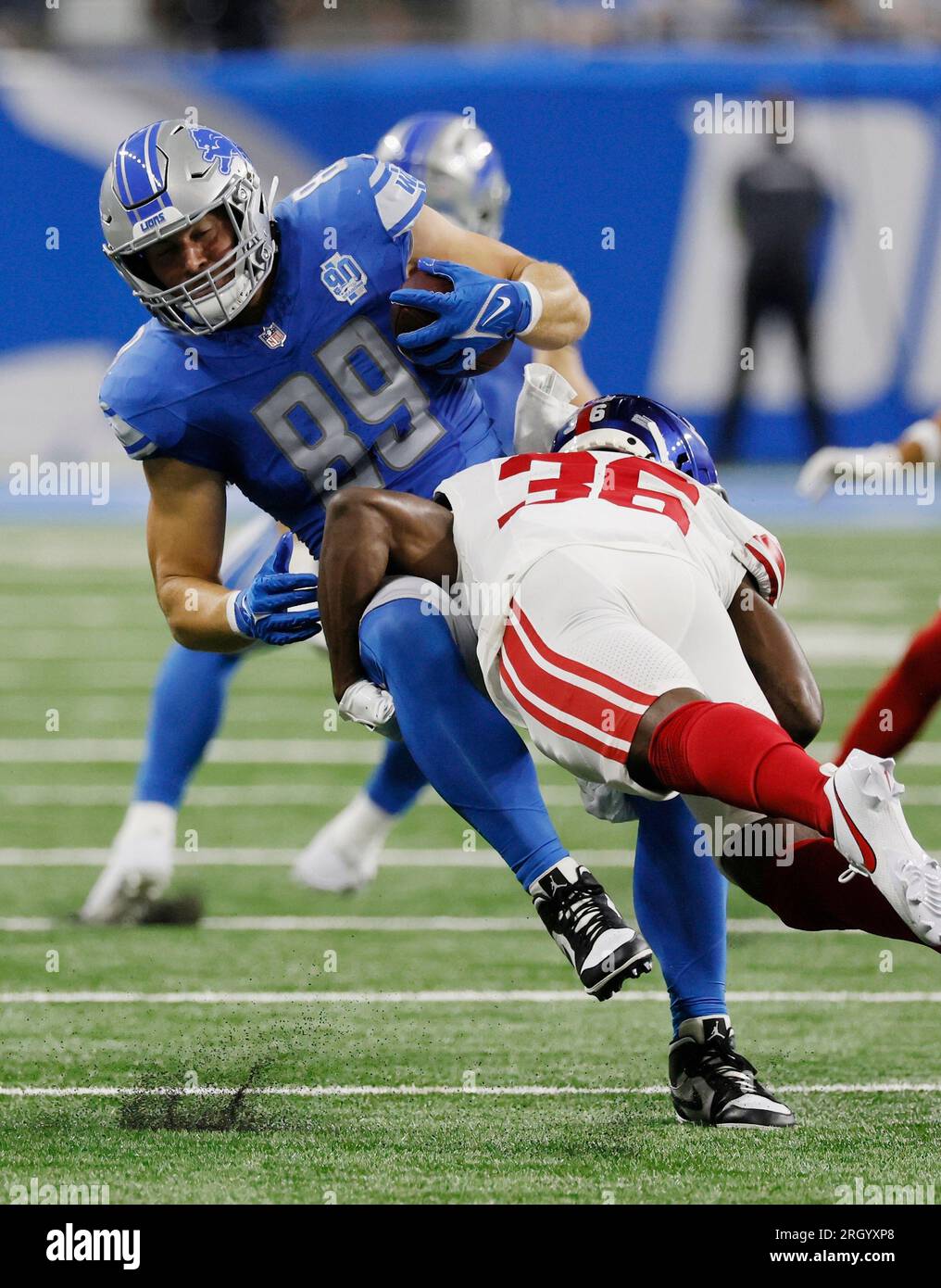 Detroit Lions tight end Brock Wright (89) is tackled by New York Giants cornerback Deonte Banks ...