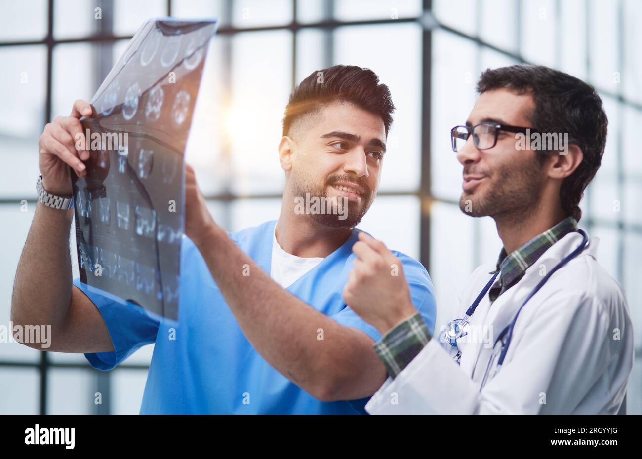 Medical workers in hospital examine x-ray prints Stock Photo - Alamy
