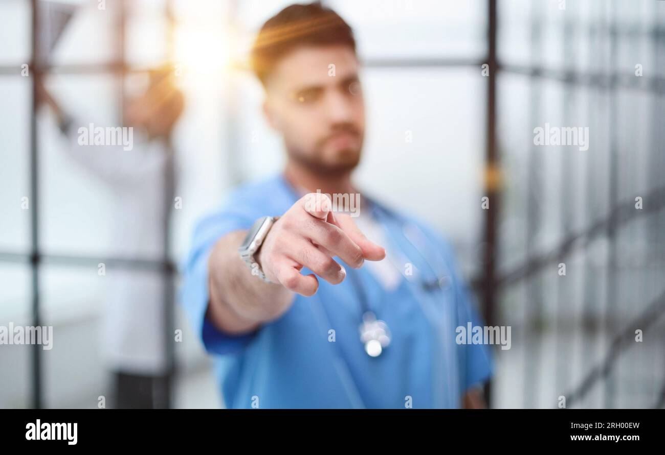 Doctor pointing his finger hi-res stock photography and images - Alamy