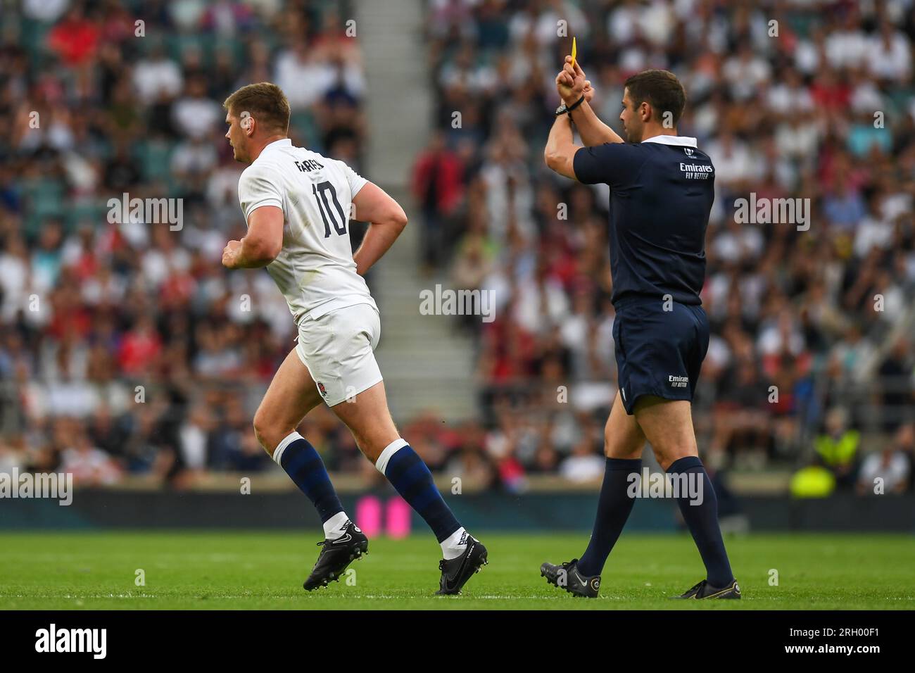 referee Nika Amashukeli gives a yellow card to Owen Farrell of England during the 2023 Summer ...