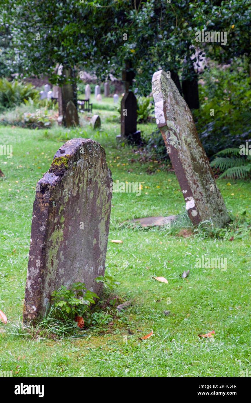 Graves in the cemetery at St Andrew's Church, Castle Combe Village in ...