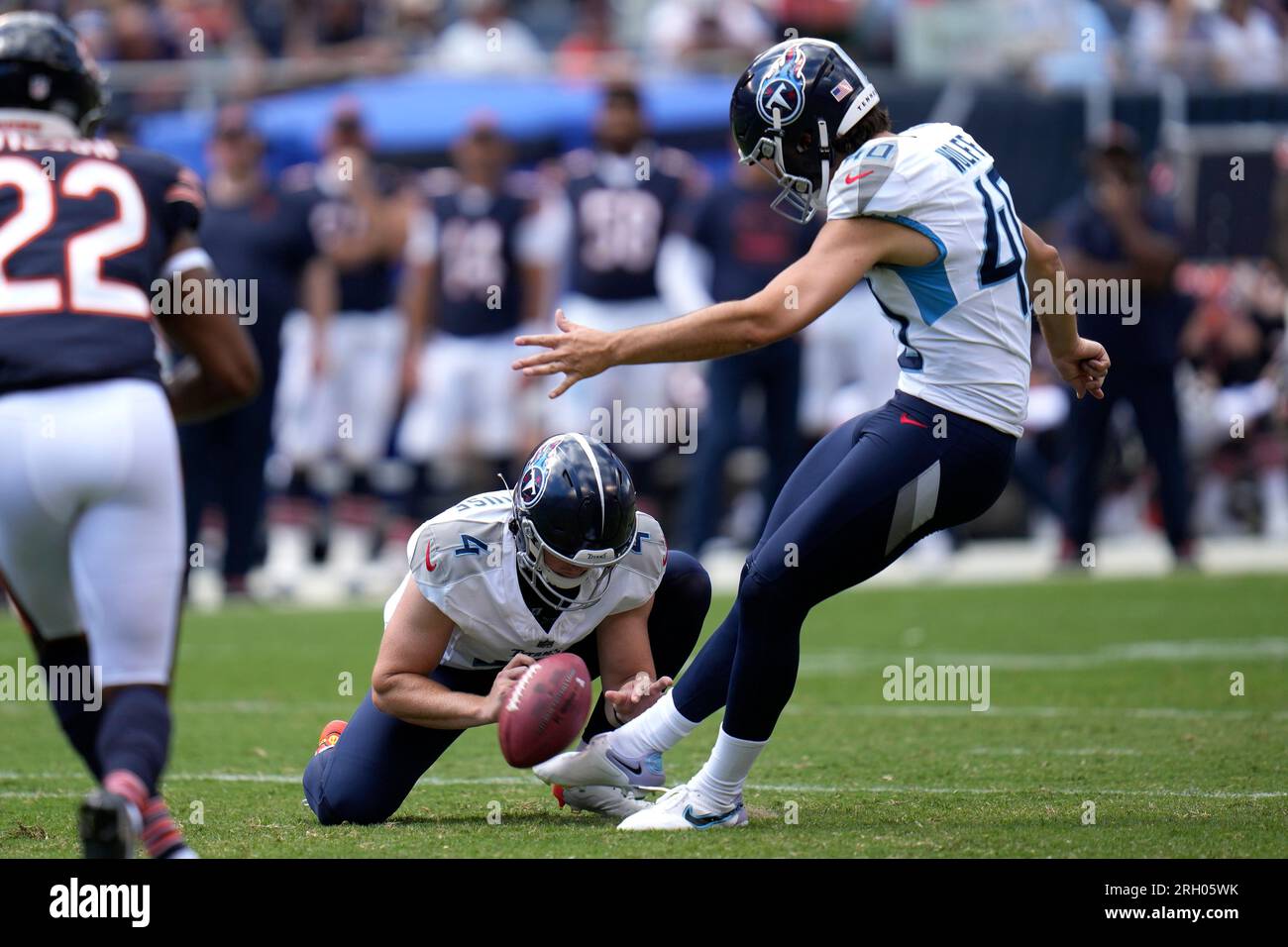 Tennessee Titans place-kicker Trey Wolff, right, unsuccessfully ...