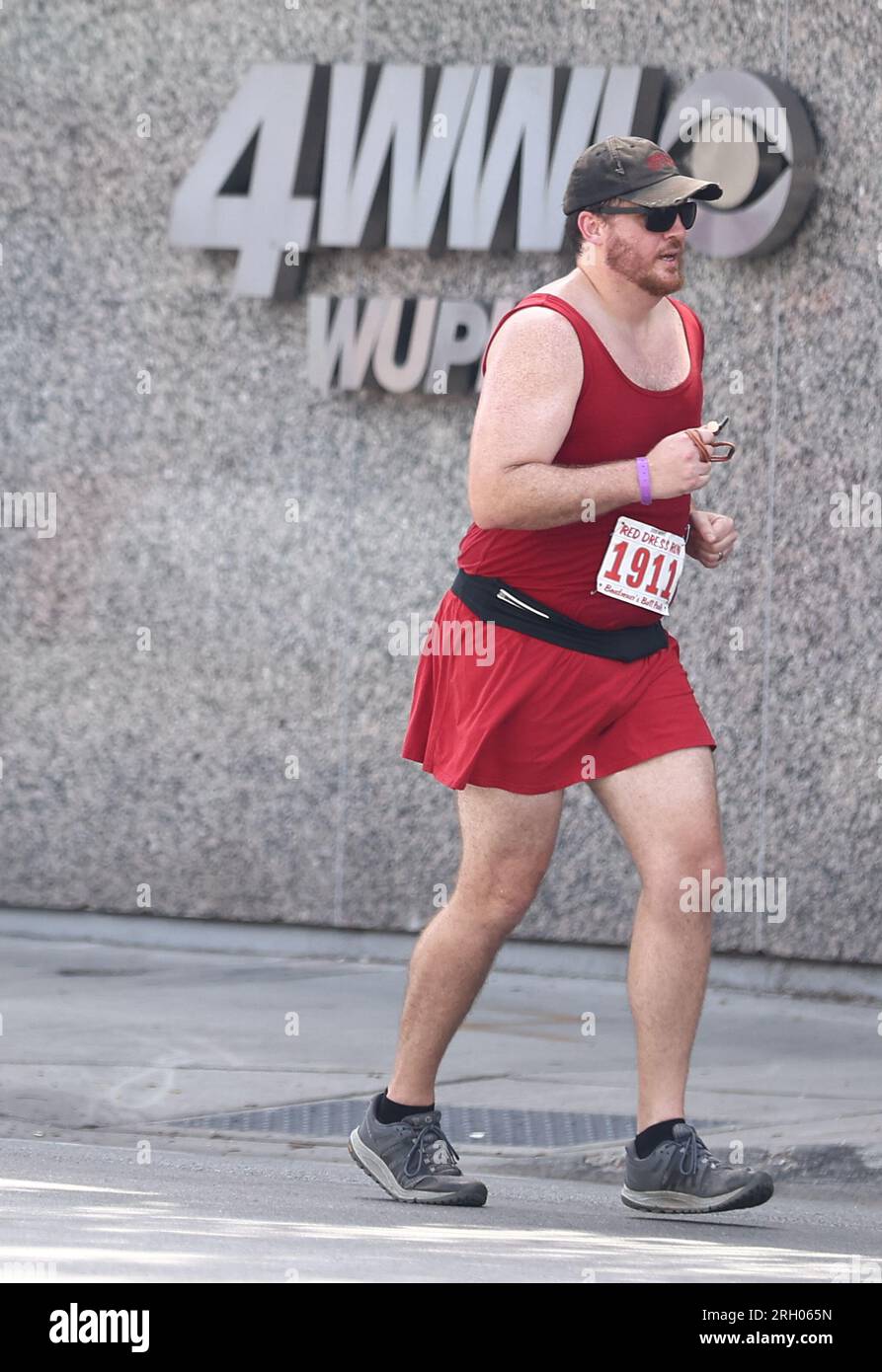 New Orleans, USA. 12th Aug, 2023. A participant of the Red Dress Run ...