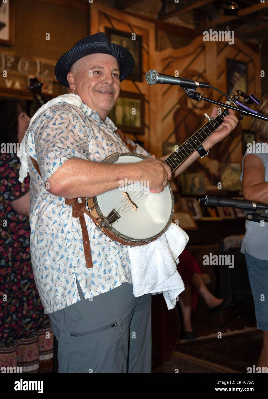 A musician (Dr. Mark Handy) plays a banjo at the Carter Fold, a country ...