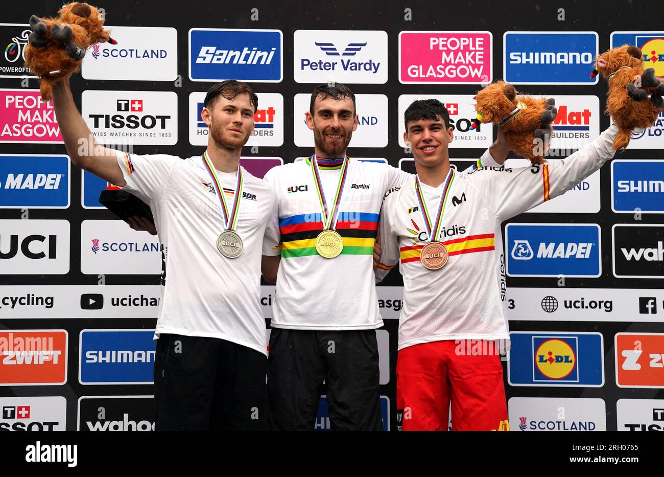 Great Britain's Jack Carthy (centre) celebrates with the gold medal ...