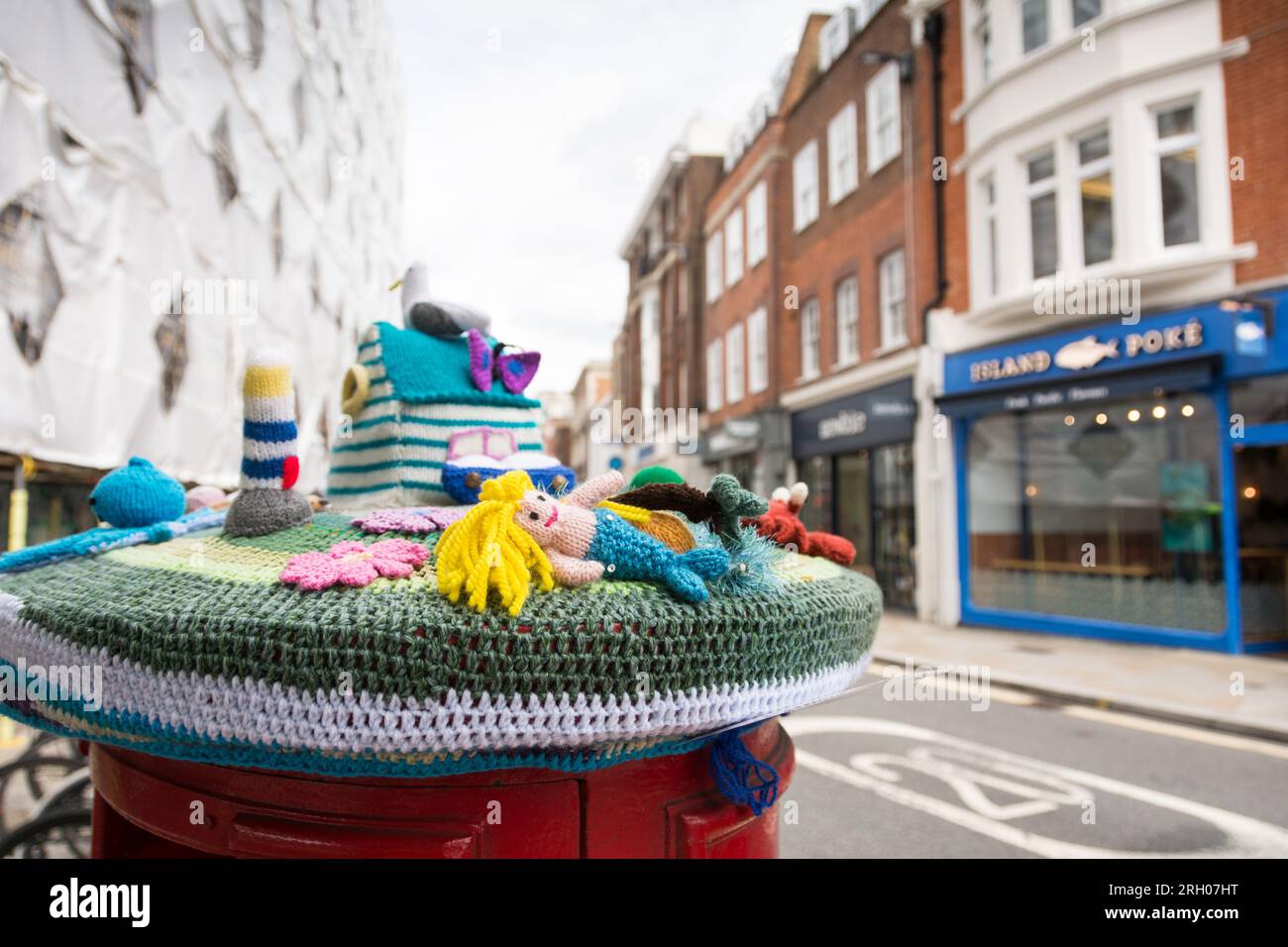 A colourful post box topper on George Street, Richmond, TW9, Surrey ...