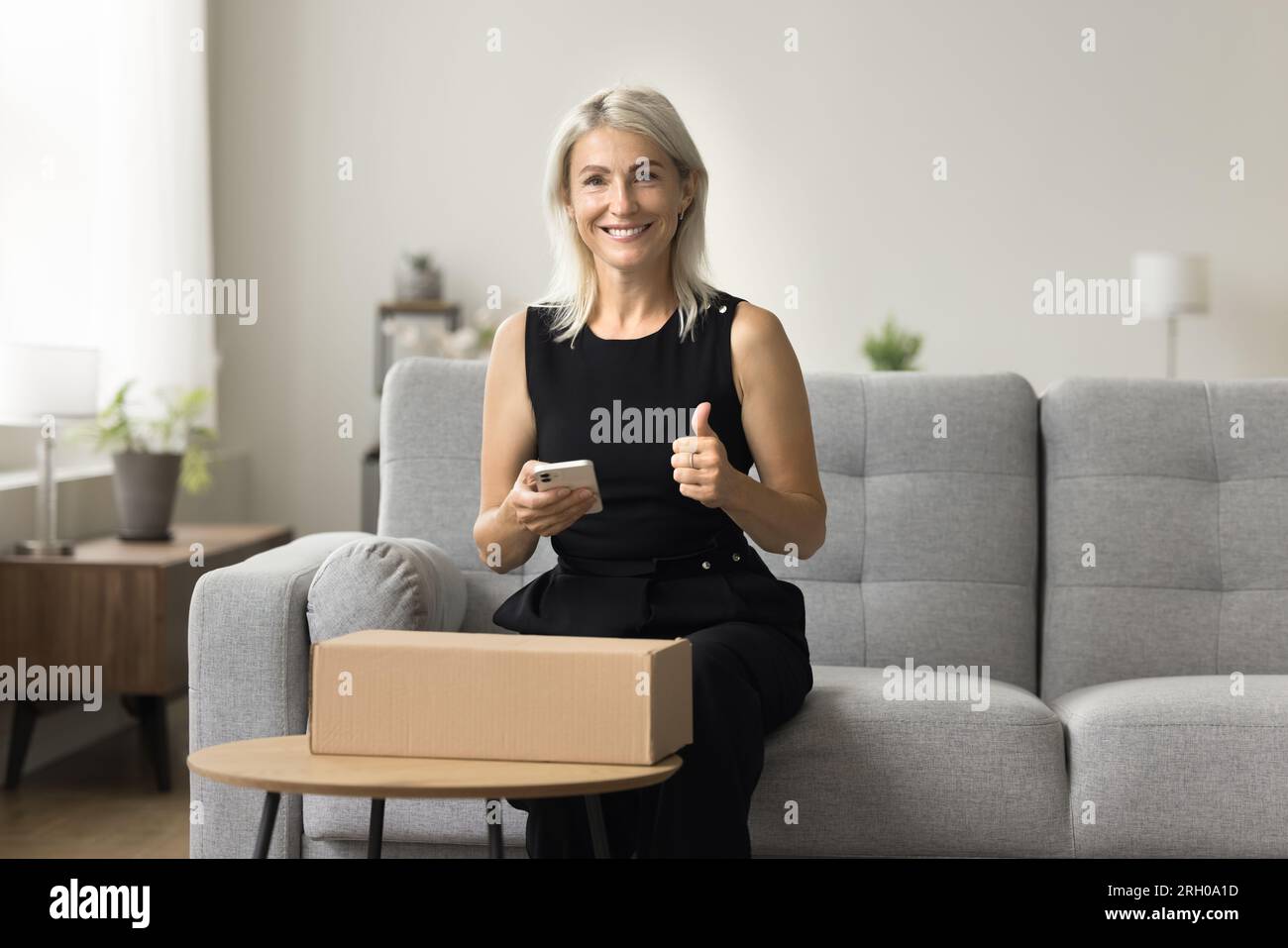 Happy satisfied mature Internet shop customer showing like sign Stock ...