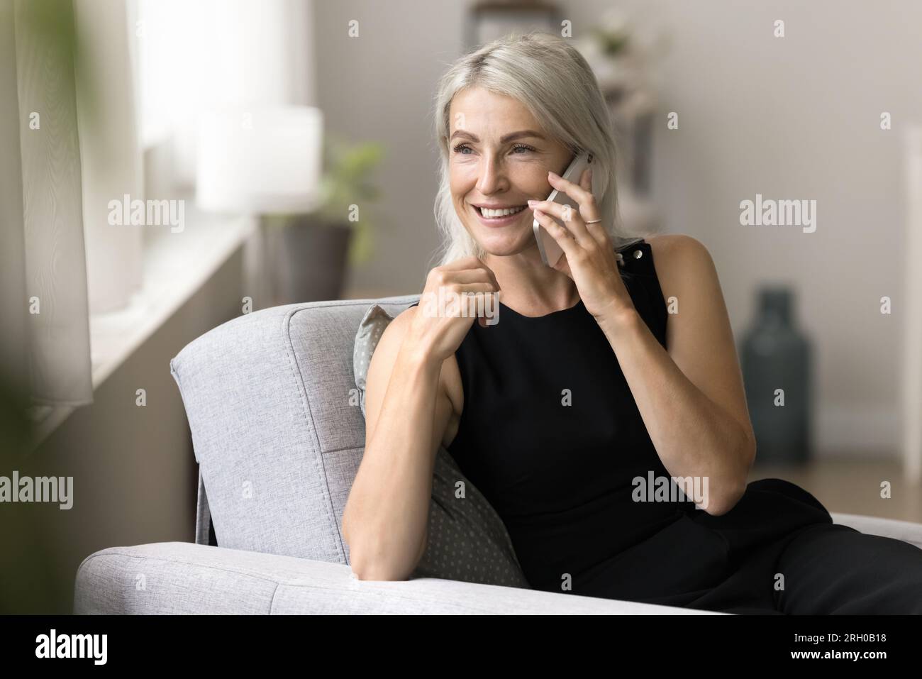 Cheerful senior lady speaking hi-res stock photography and images - Alamy