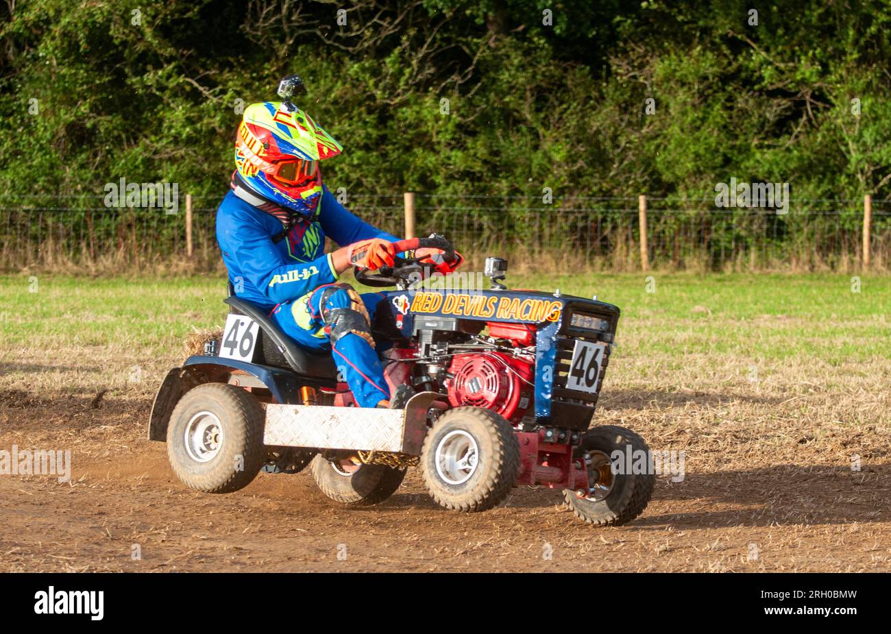 A racing lawn mower driver struggled to control his mower as he corners ...