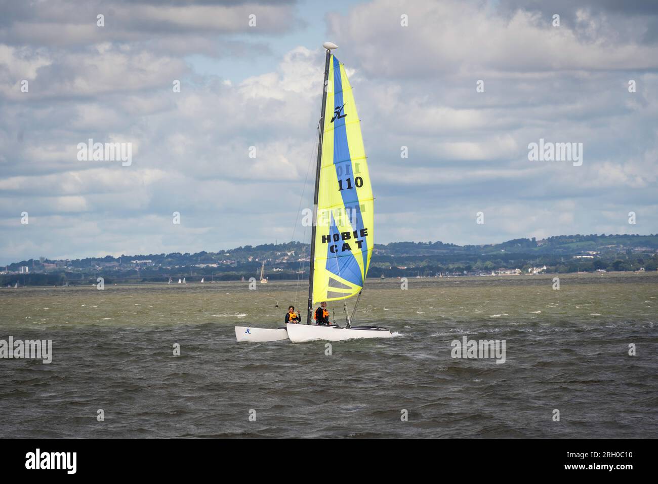 Exmouth, UK - August 2023: A father and son sailing in the river Exe ...