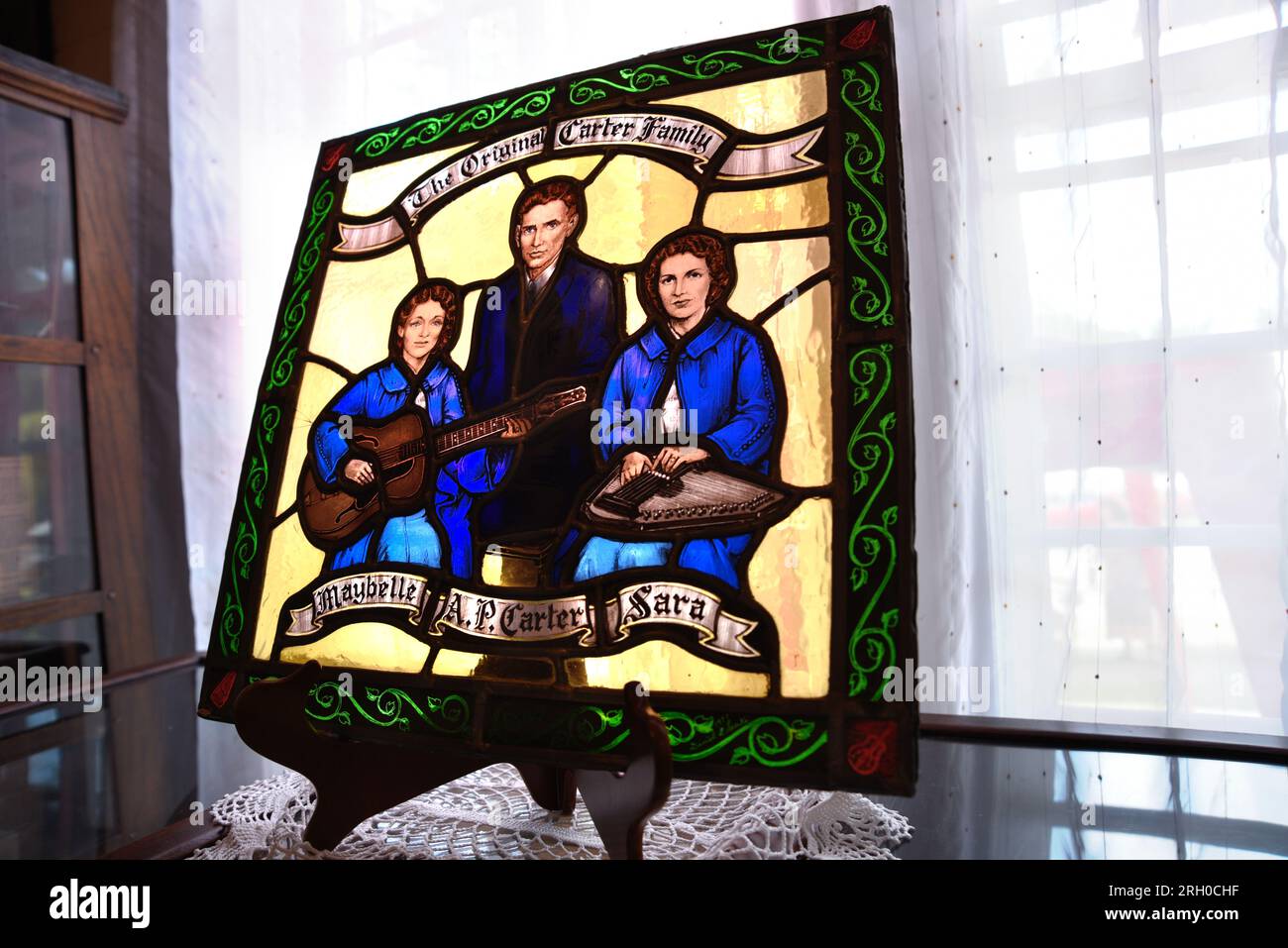 A stained glass window portrait of country music pioneers The Carter ...