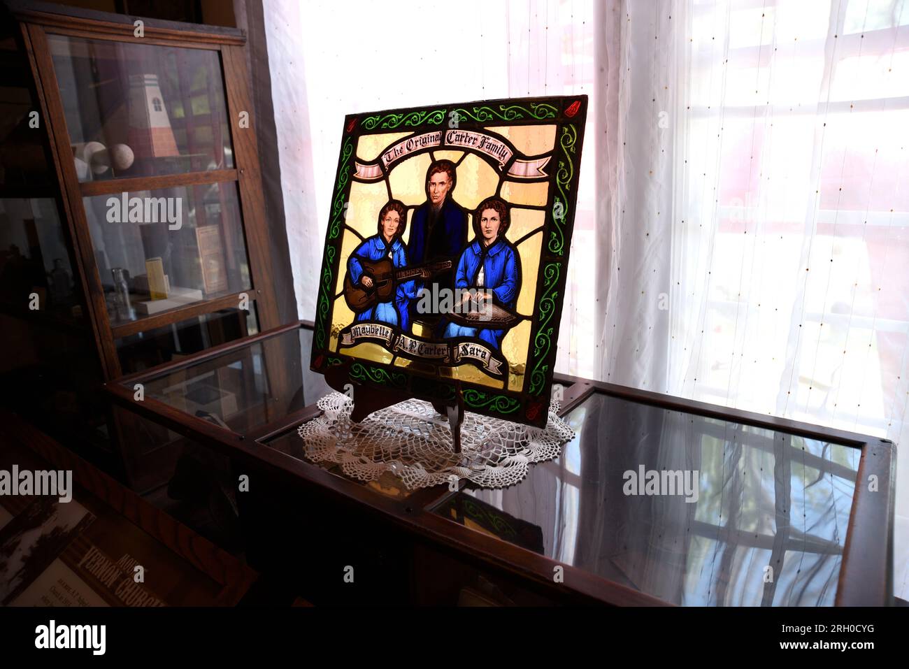 A stained glass window portrait of country music pioneers The Carter ...