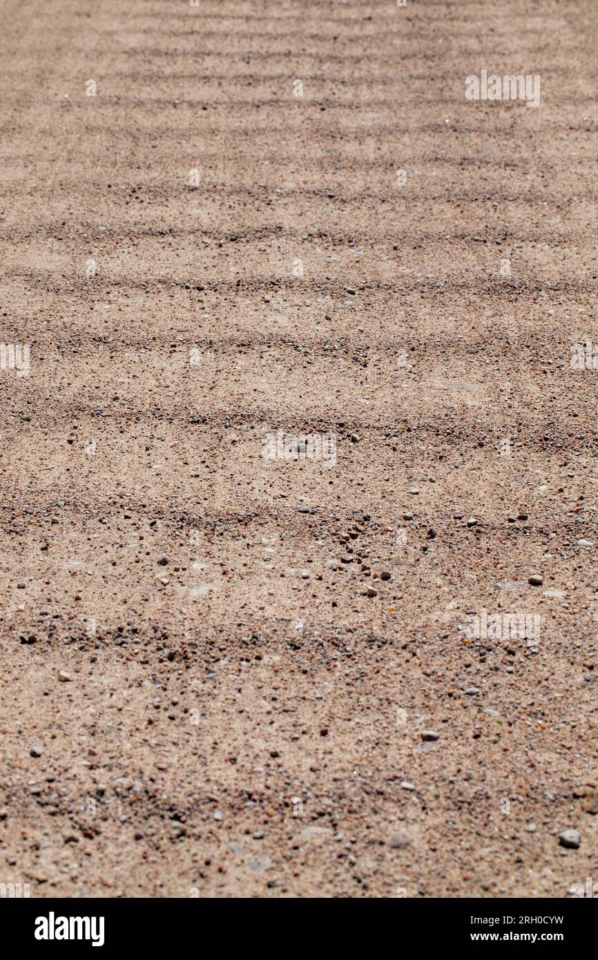 features on paved sandy road in rural area, road for traffic in rural ...