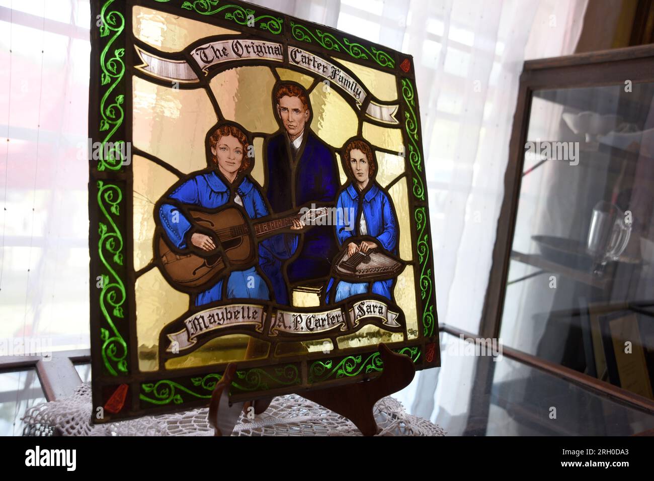 A stained glass window portrait of country music pioneers The Carter ...