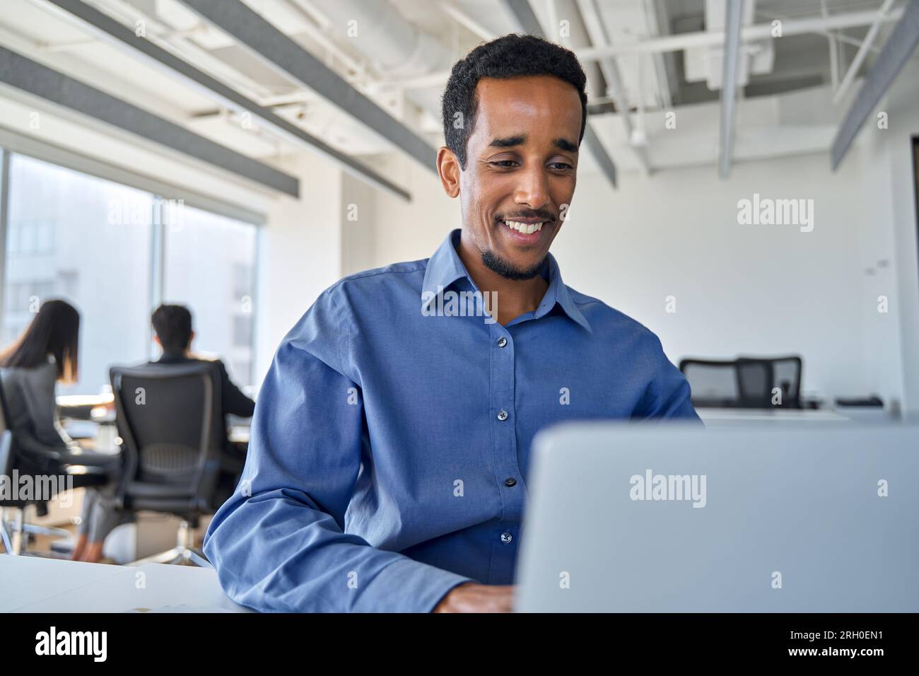 Busy African business man employee using laptop working in office Stock ...