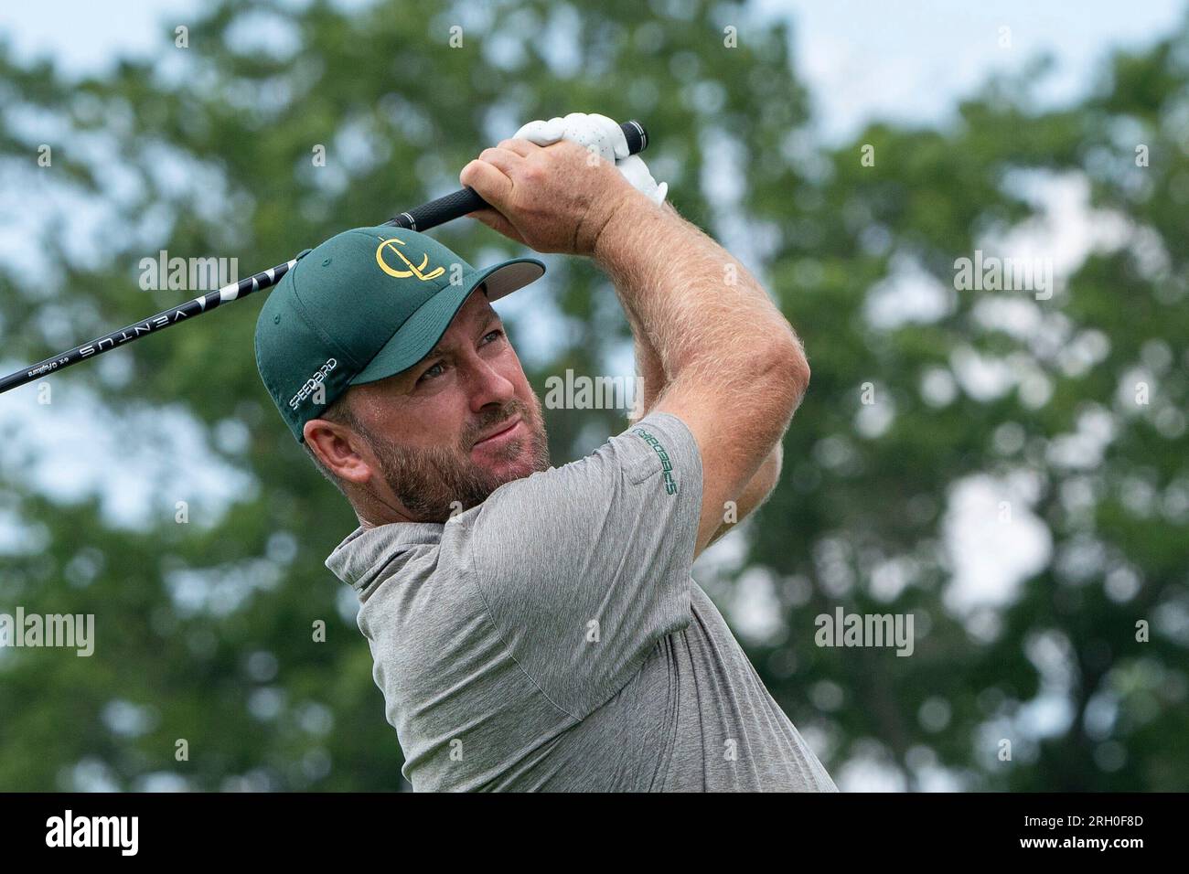 Graeme McDowell of Cleeks GC watches his shot from the 13th tee during ...