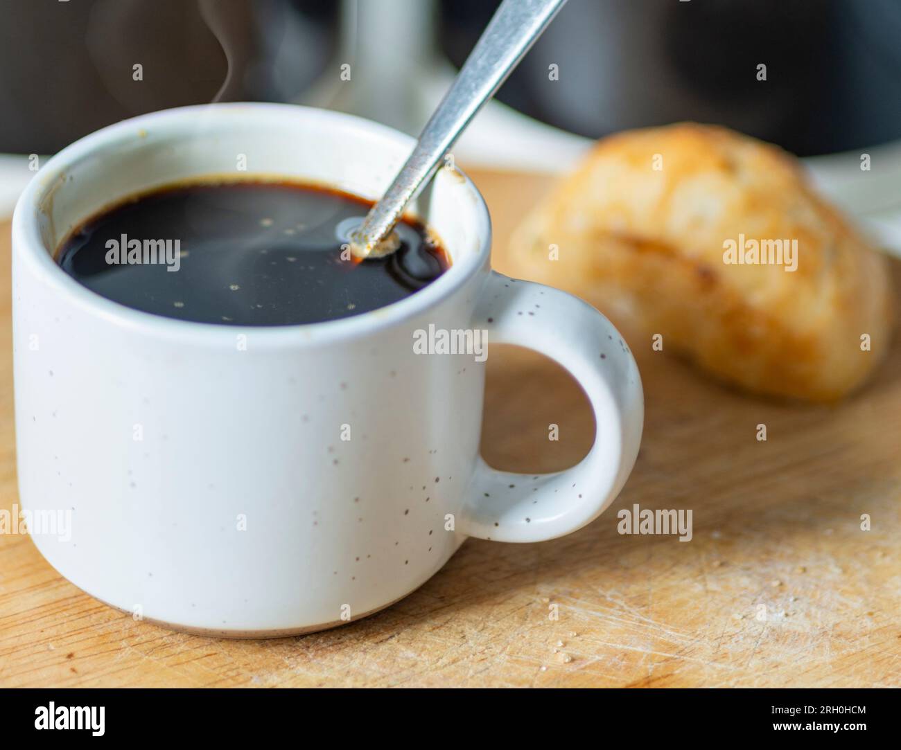 Freshly poured,hot,ready to drink,in an espresso coffee mug and silver ...