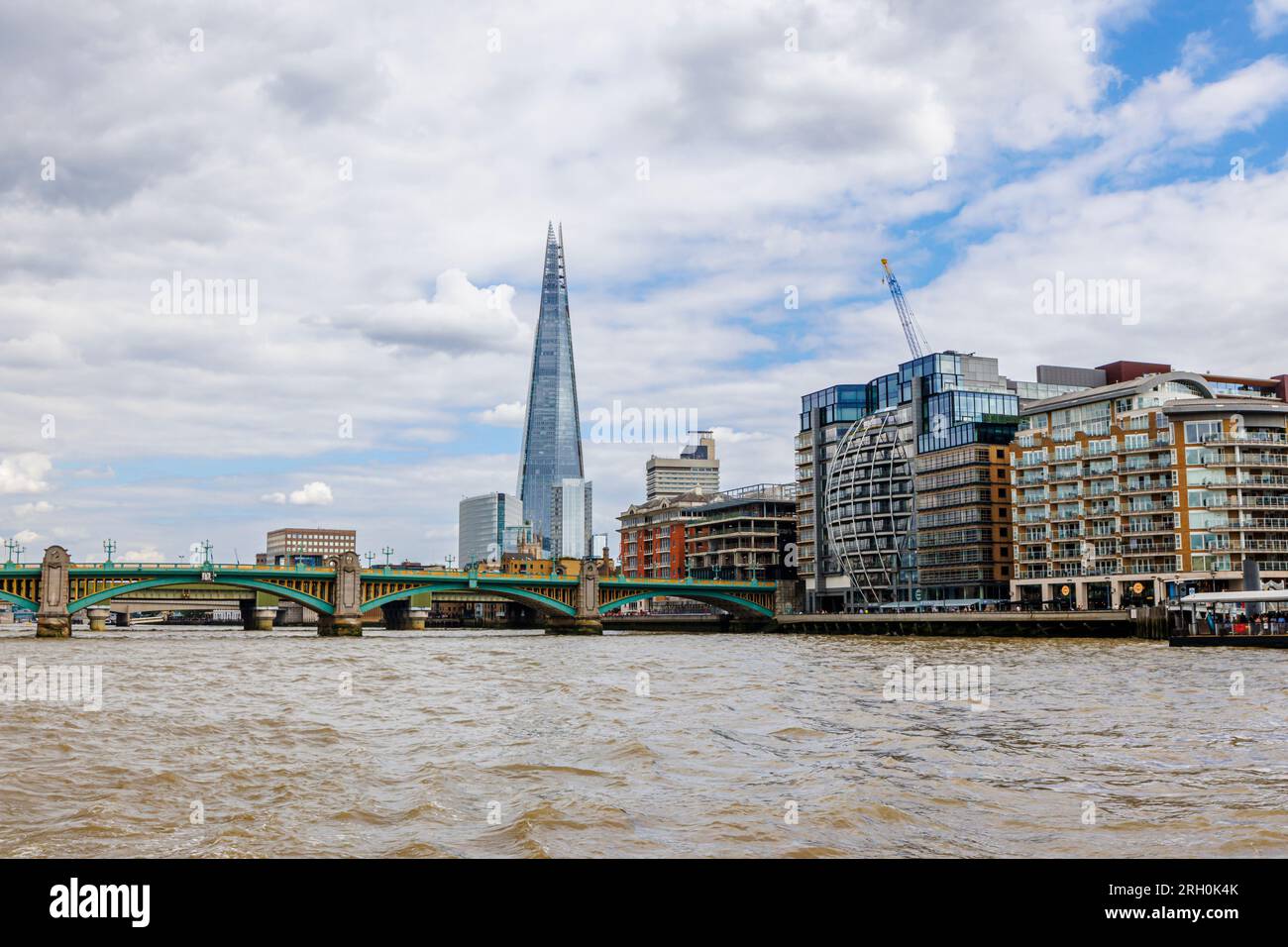 View downstream (east) along the River Thames with Southwark Bridge and ...