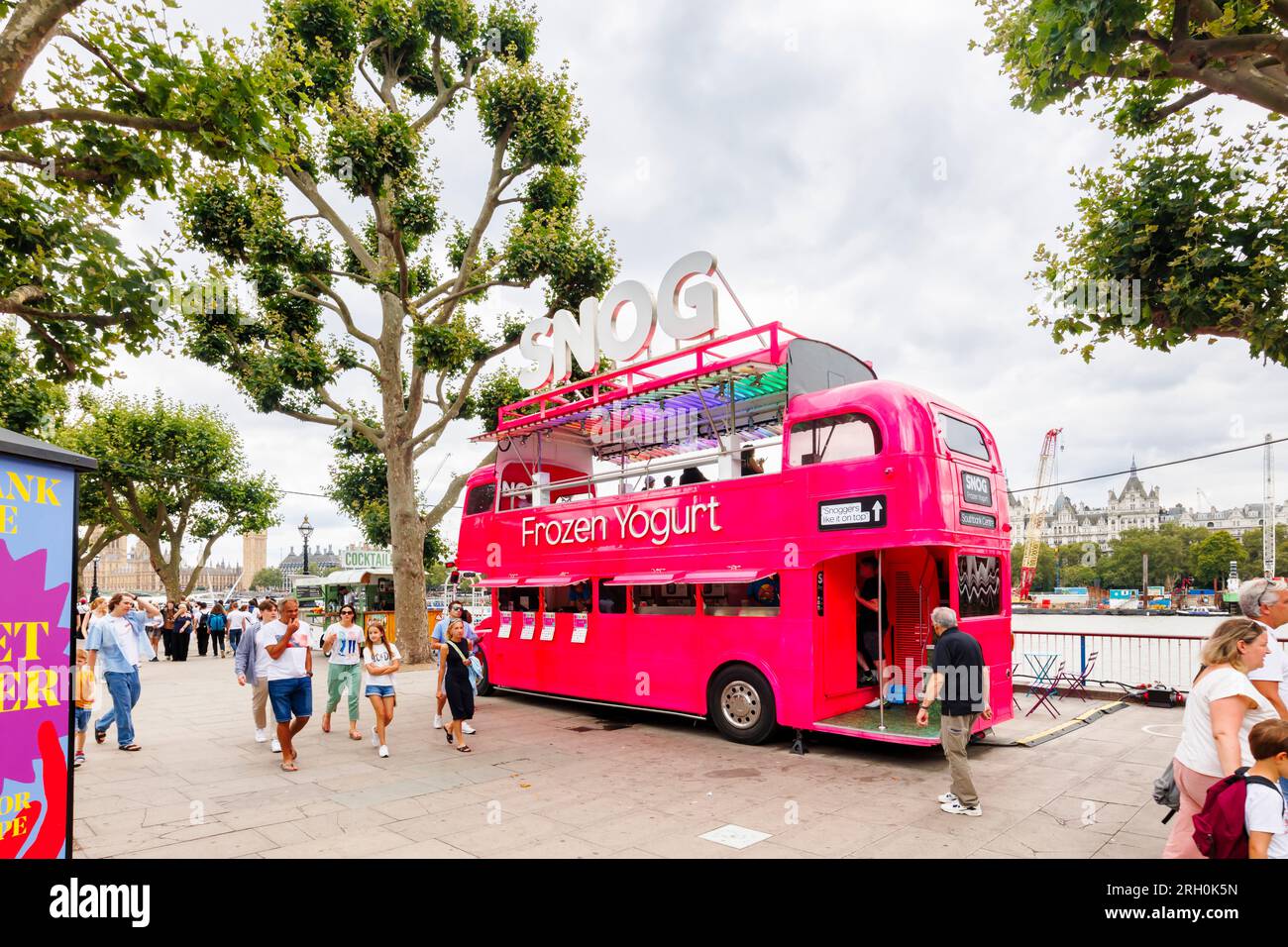 A pink converted bus selling SNOG frozen yogurt snacks on Queen's Walk ...