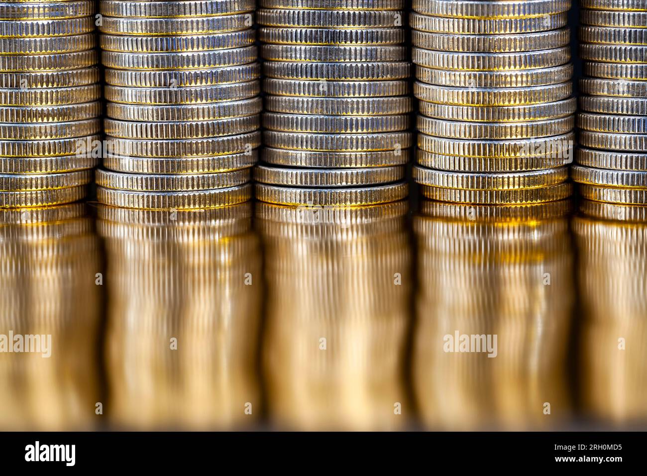 a large number of coins lying together, metal coins of different ...
