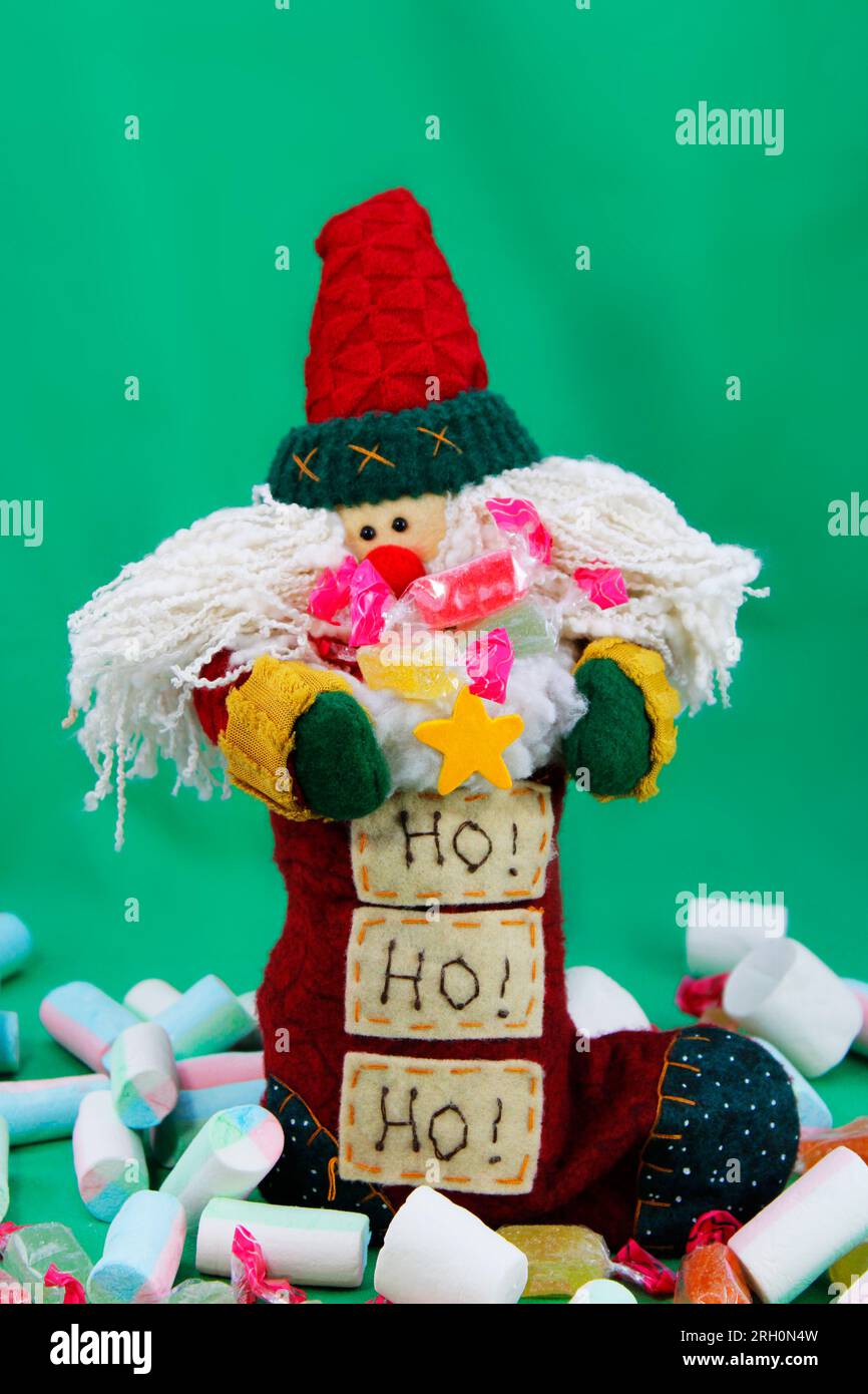 Candy boot with Santa Claus face Stock Photo - Alamy