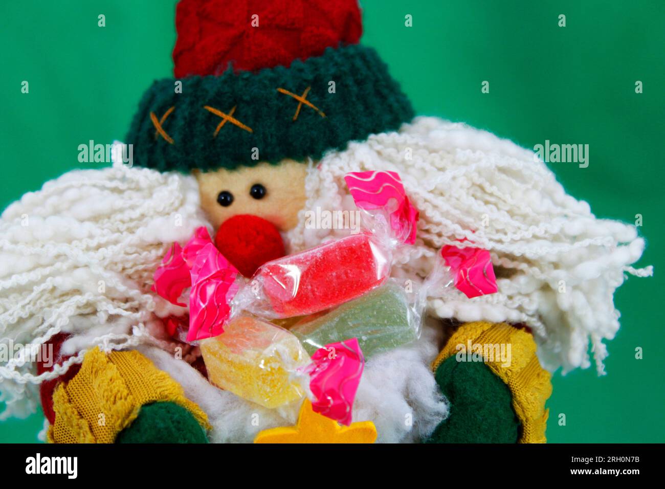 Candy boot with Santa Claus face Stock Photo - Alamy