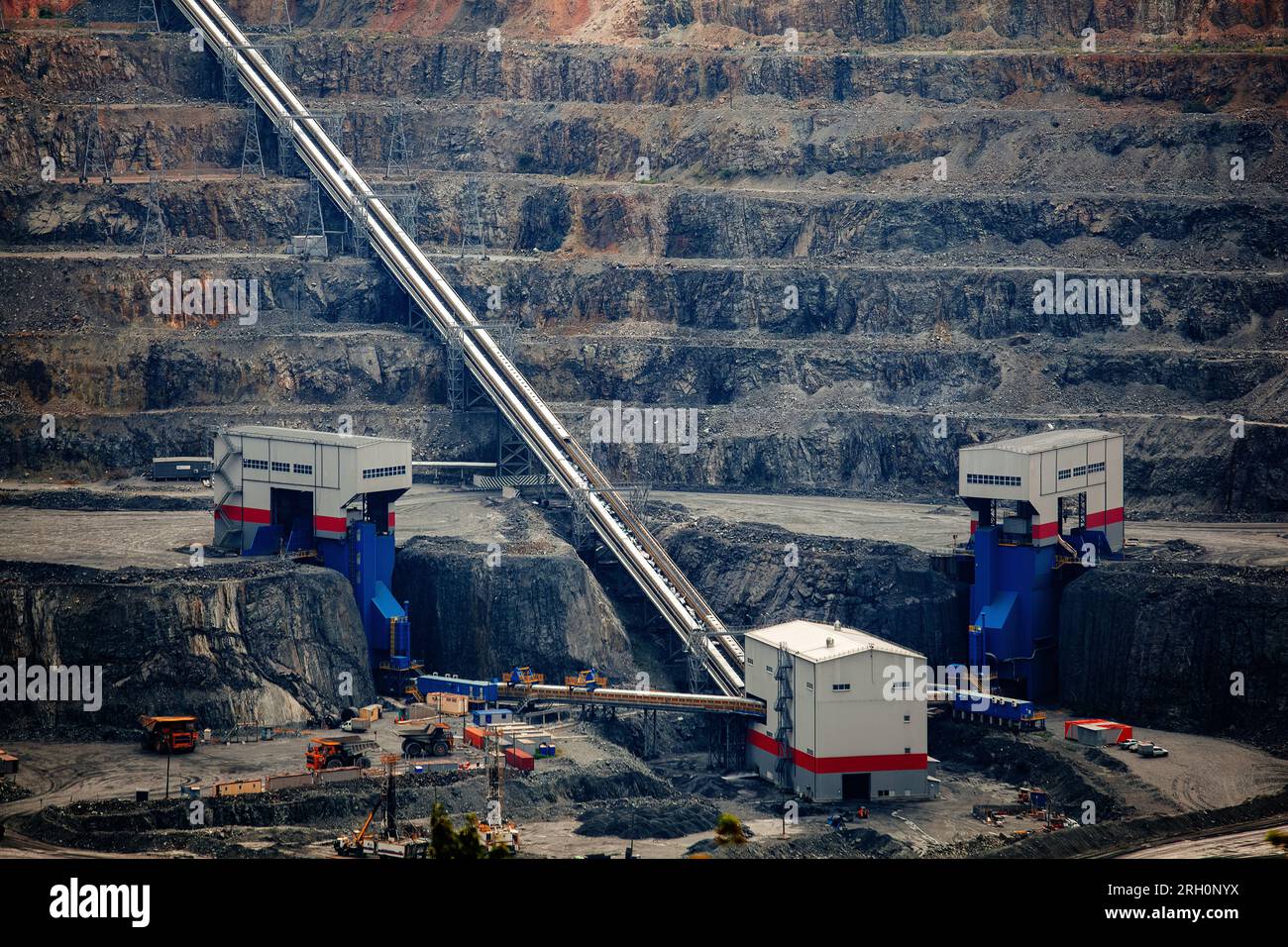 Large conveyor belt in open pit mine for ore transportation Stock Photo ...