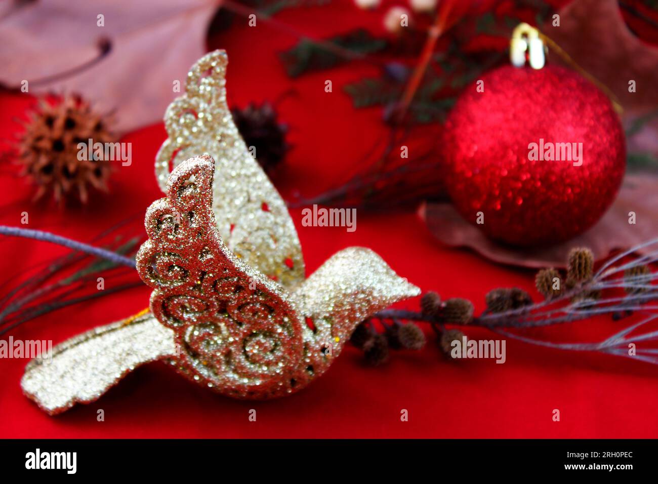 Golden dove, christmas decoration with background of dry leaves and ...