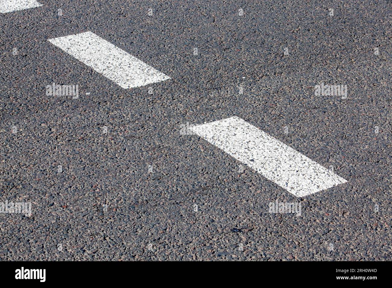 old road markings on a motorway, part of an asphalt road with road ...