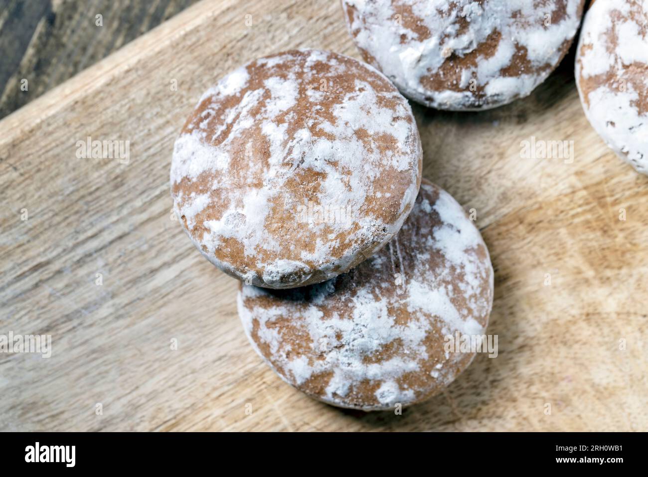 iced sugar gingerbread on a cutting board, flour pastry made of ...