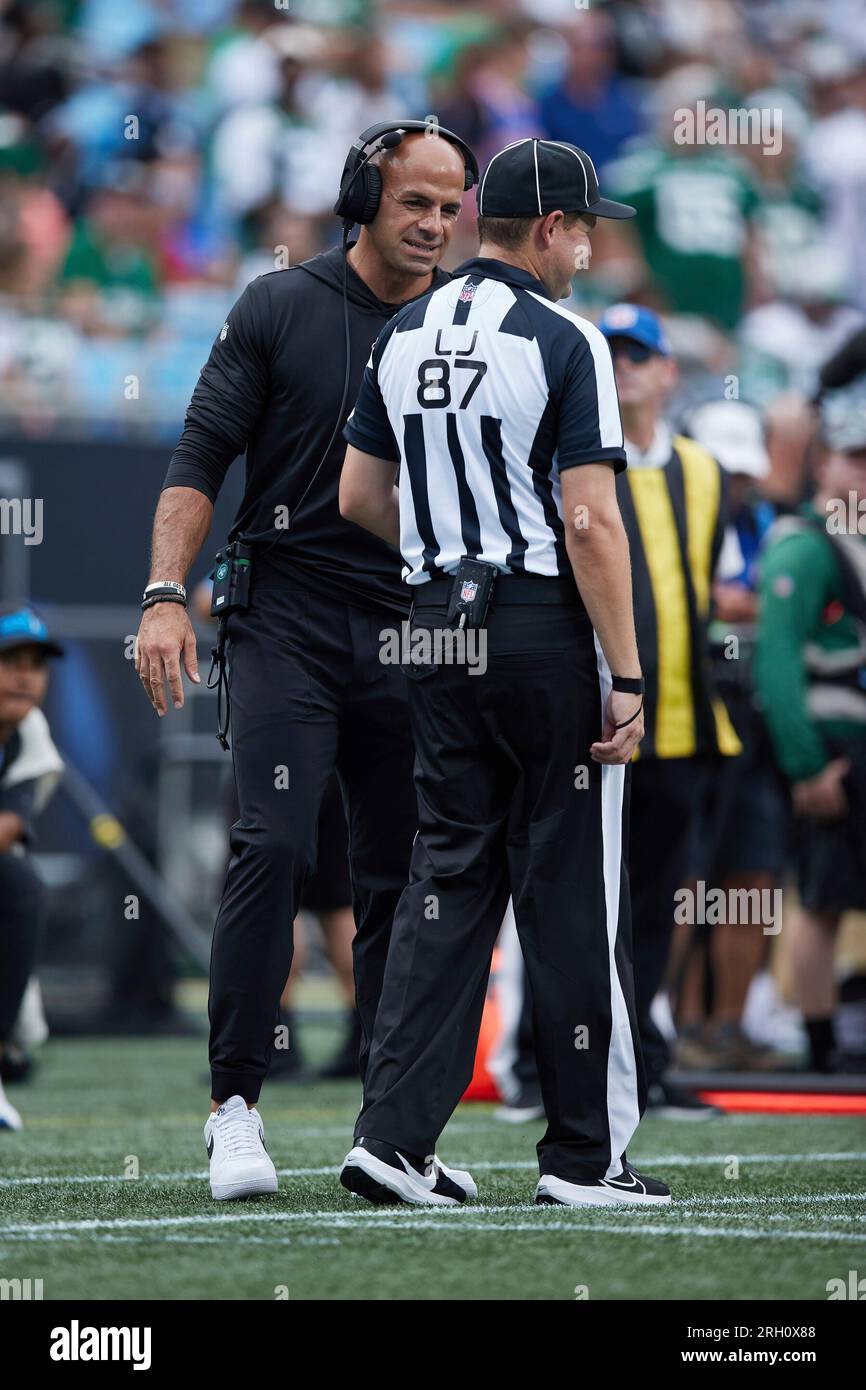 New York Jets head coach Robert Saleh chats with line judge Thomas ...