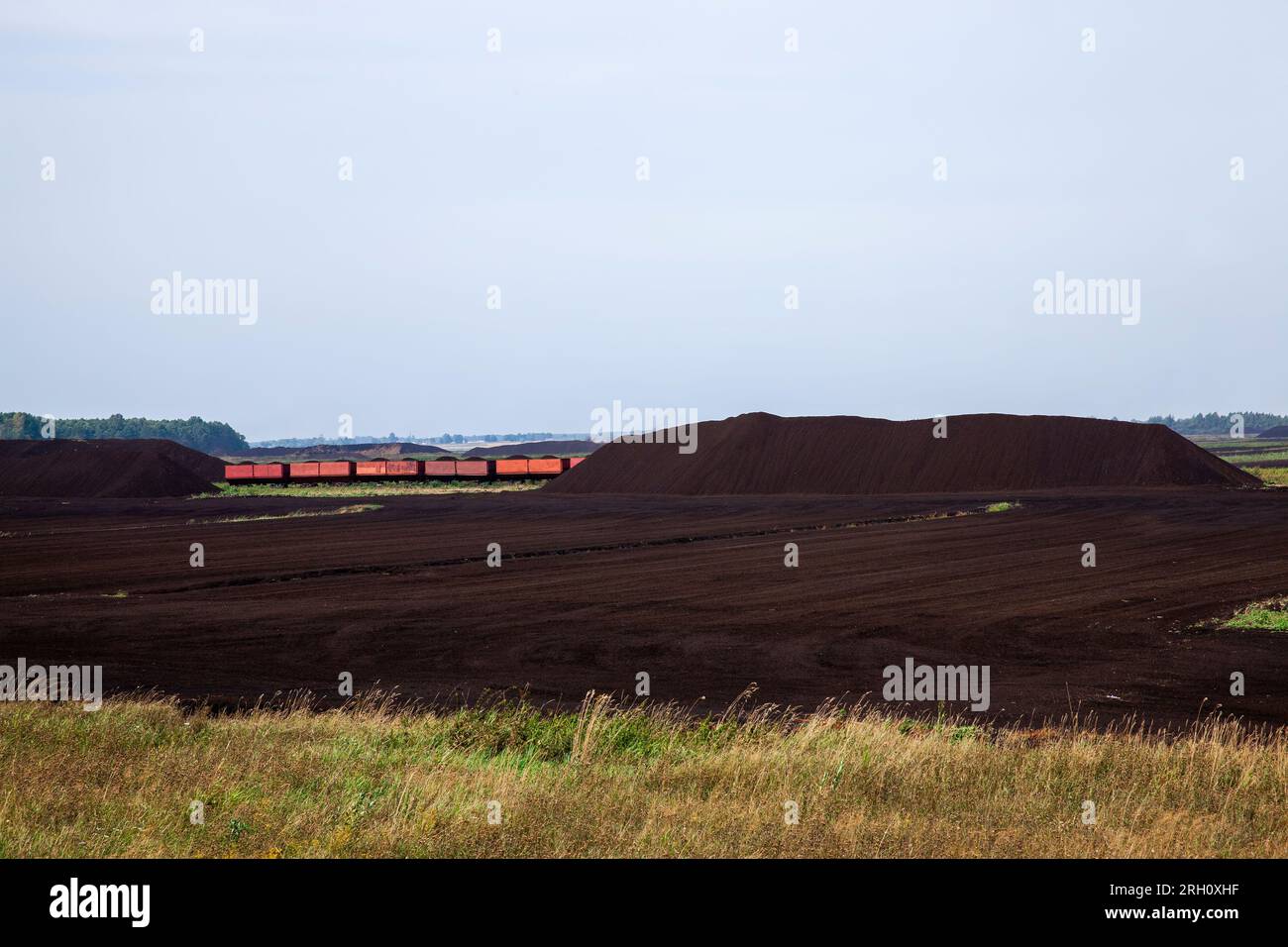 industrial area where black peat is mined, landscape in nature on the ...