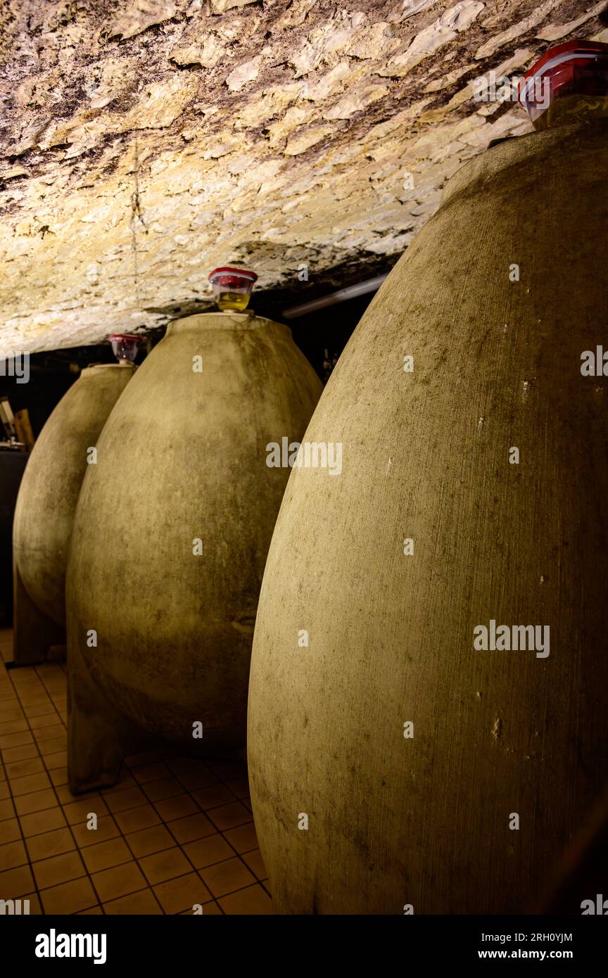 Concrete tanks eggs for fermentation process. Visit of undergrounds ...