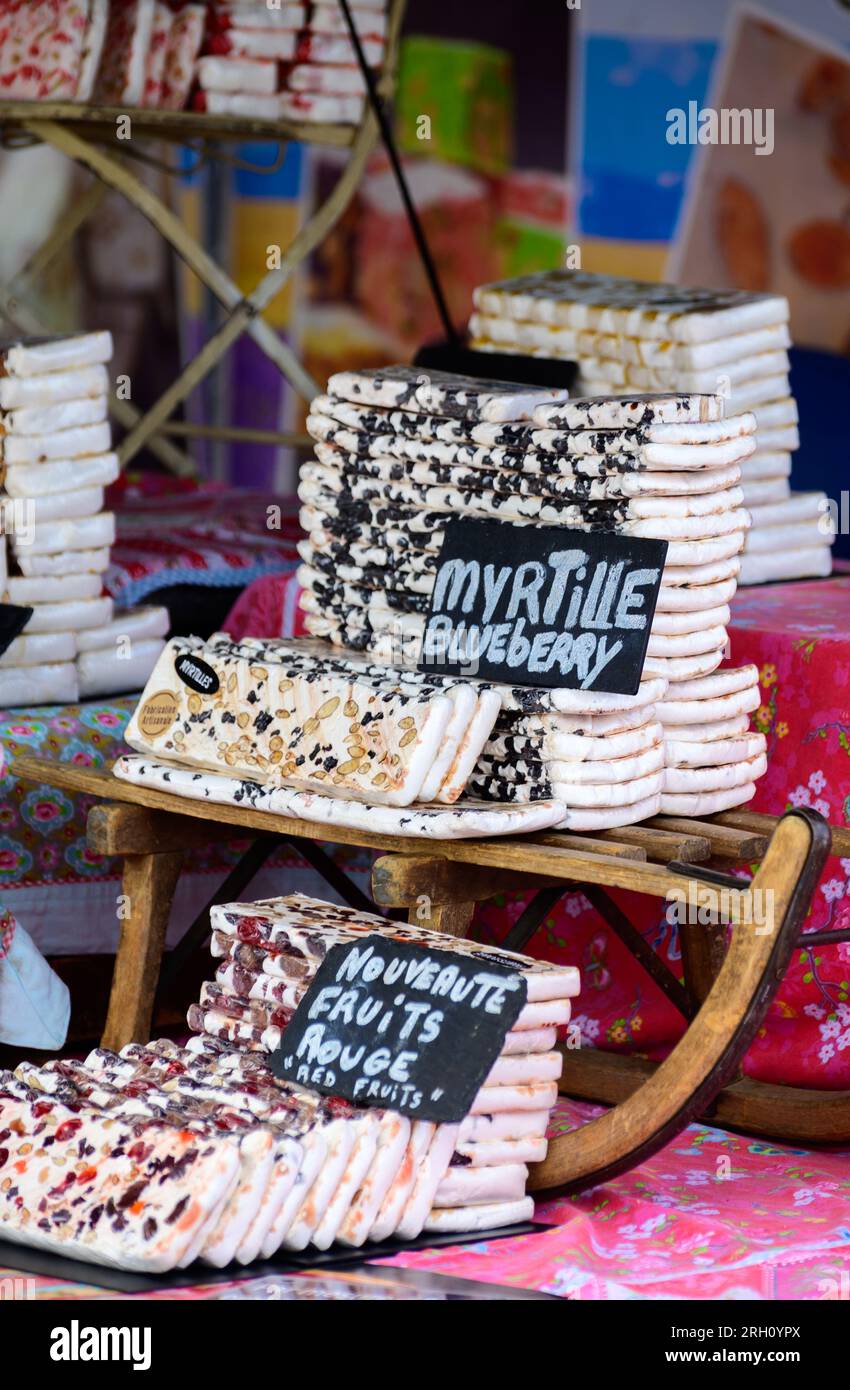 Fresh dessert traditional nougat with nuts and red and bluberry fruits ...