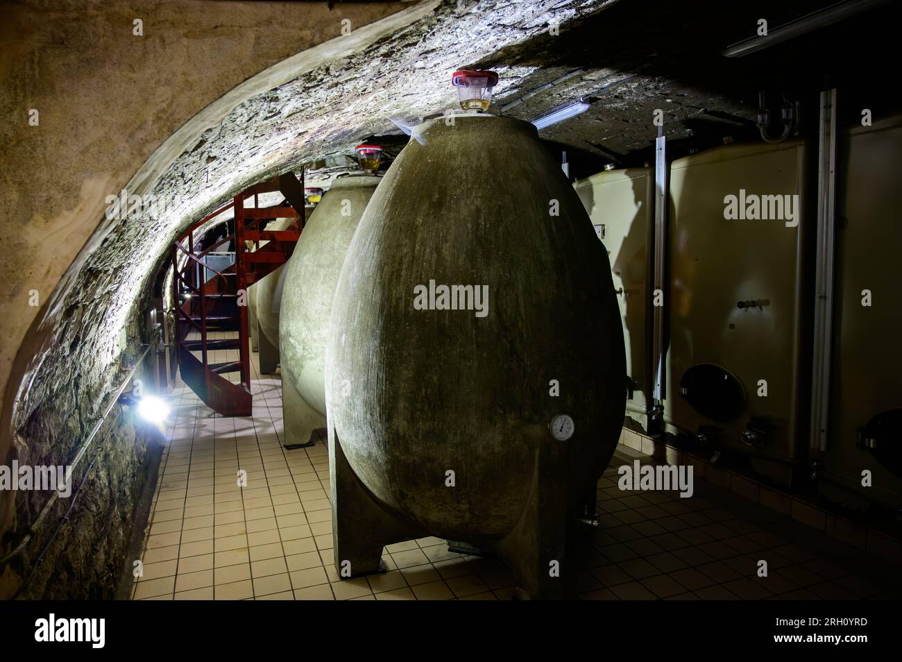 Concrete tanks eggs for fermentation process. Visit of undergrounds ...