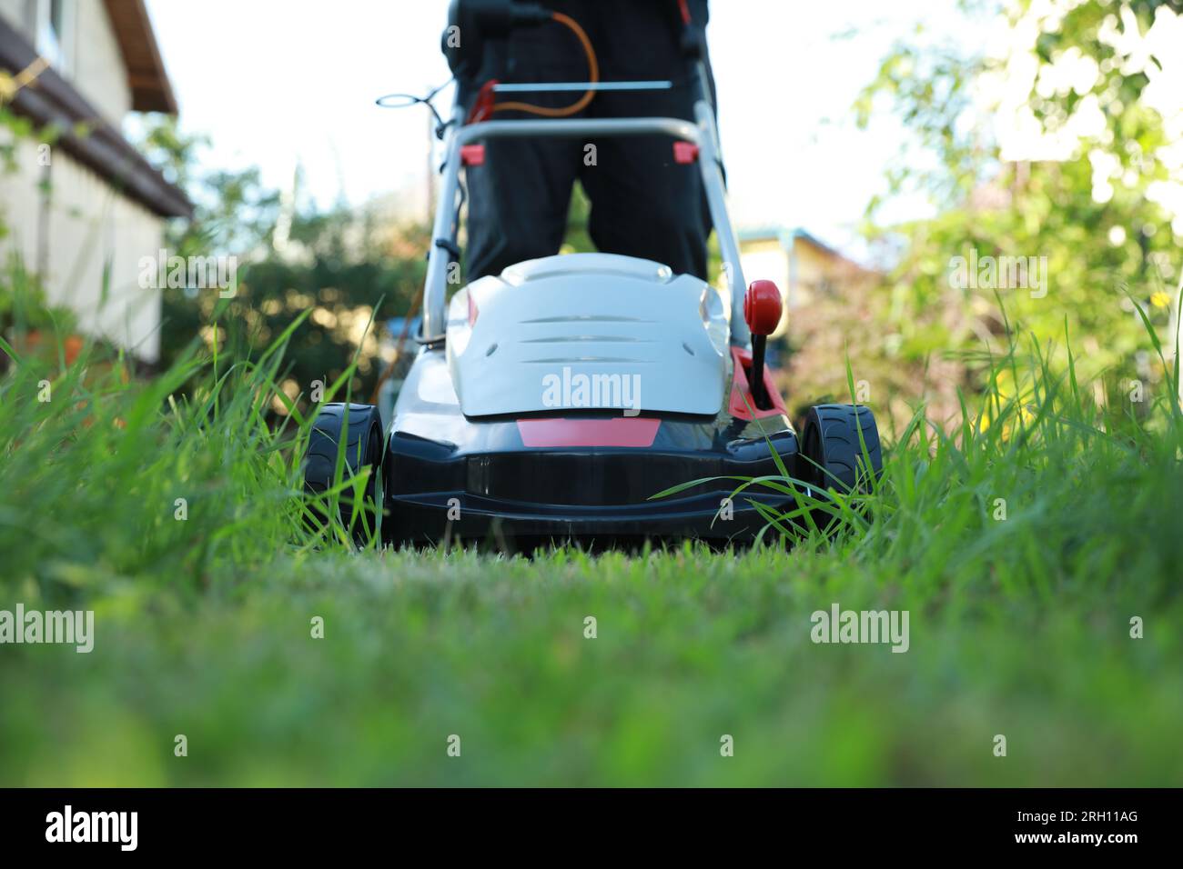 Grass man lawnmower low angle hi-res stock photography and images - Alamy