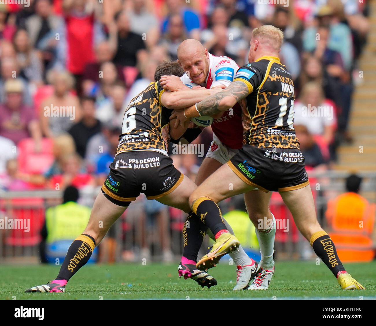 Dean Hadley #22 of Hull KR runs at the Leigh Leopards defence during ...