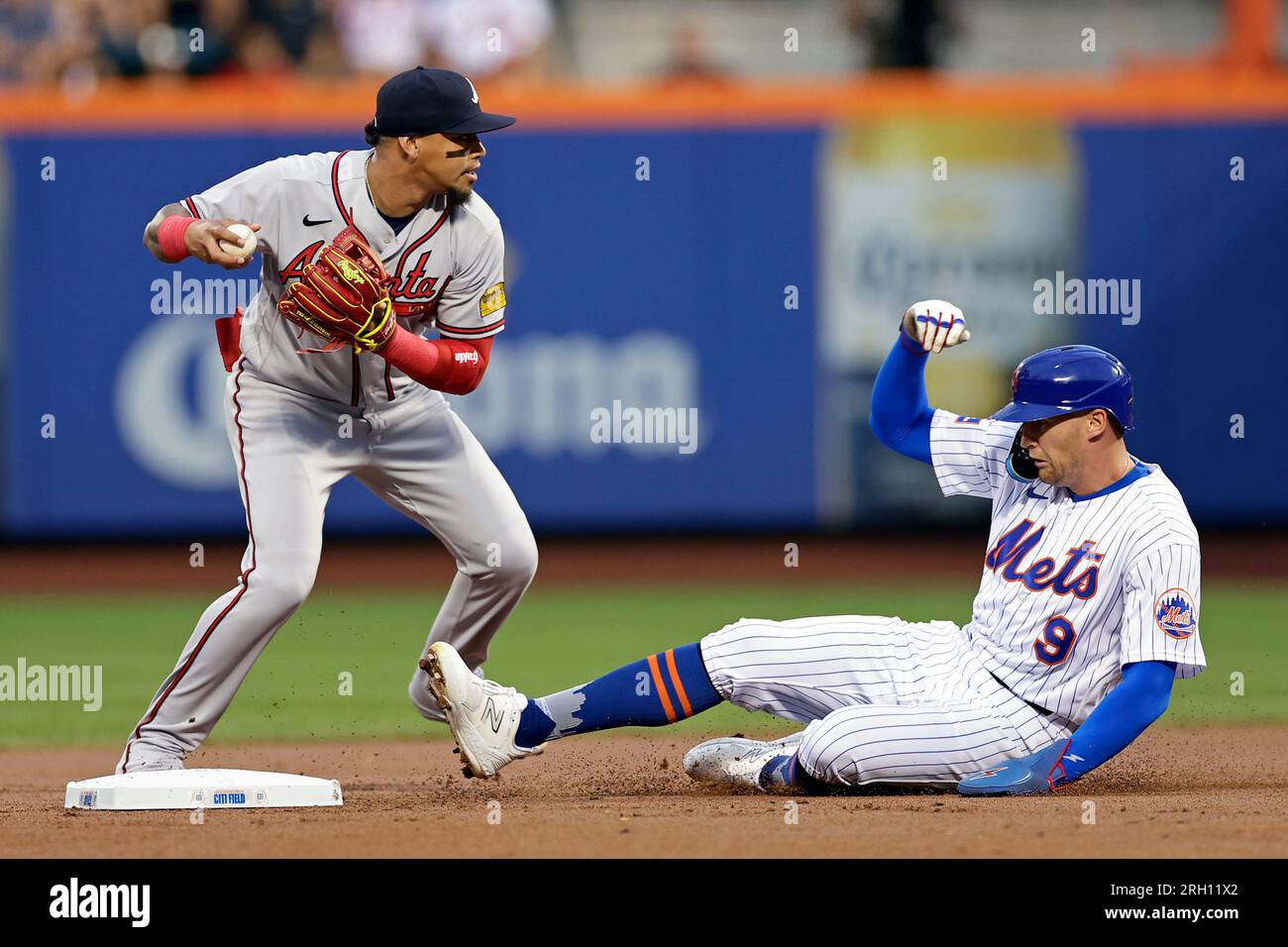 Atlanta Braves shortstop Orlando Arcia, left, gets an out against New ...