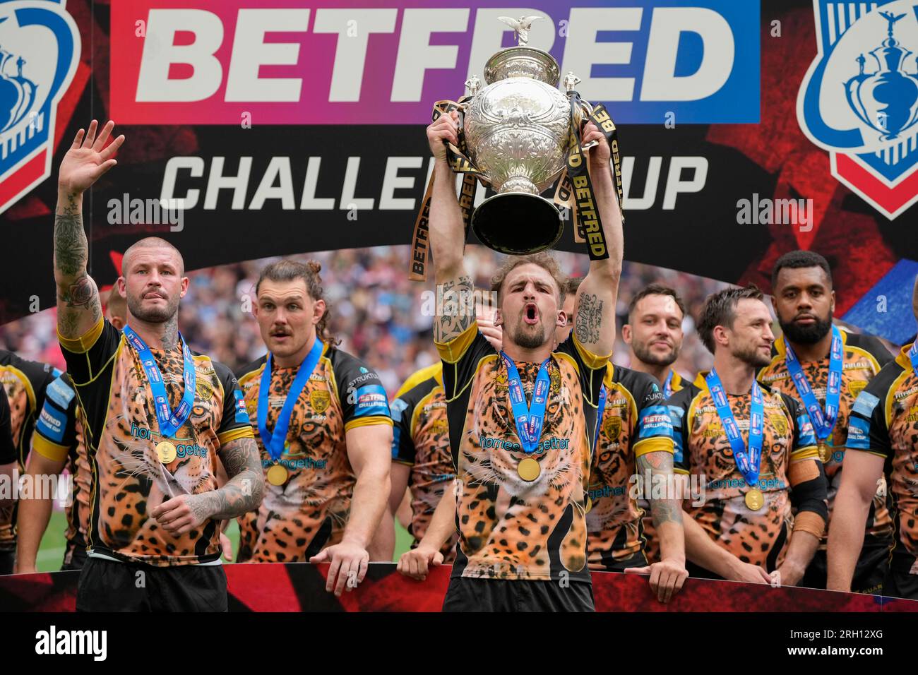 Ed Chamberlain #3 of Leigh Leopards lifts the BetFred Challenge Cup ...