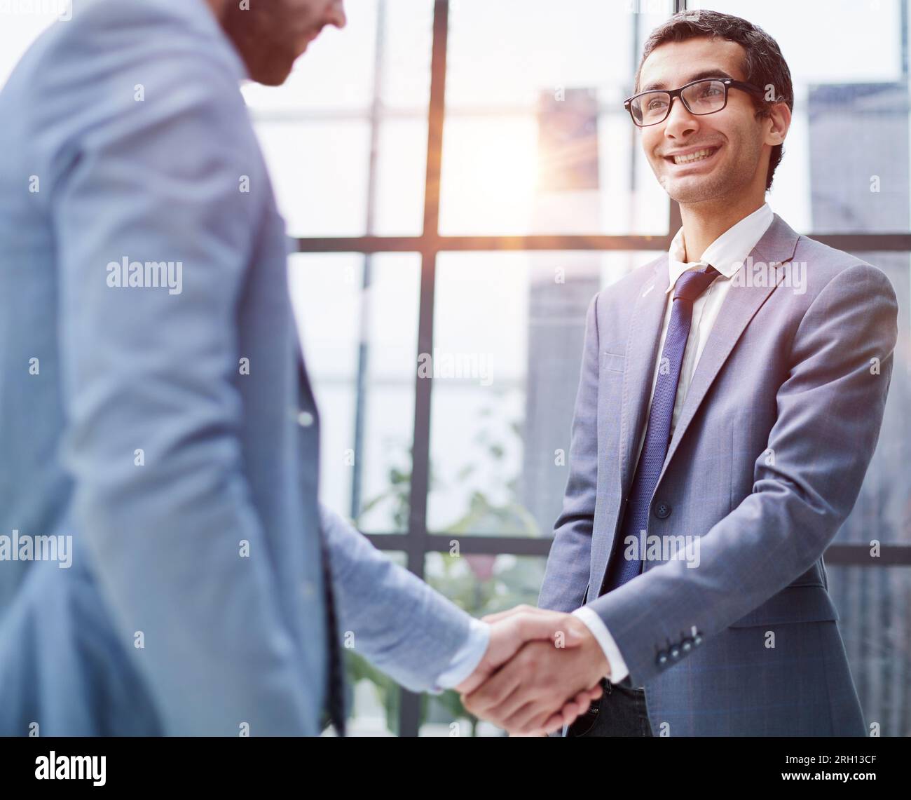 Two business men shaking hands together after successful meeting Stock ...