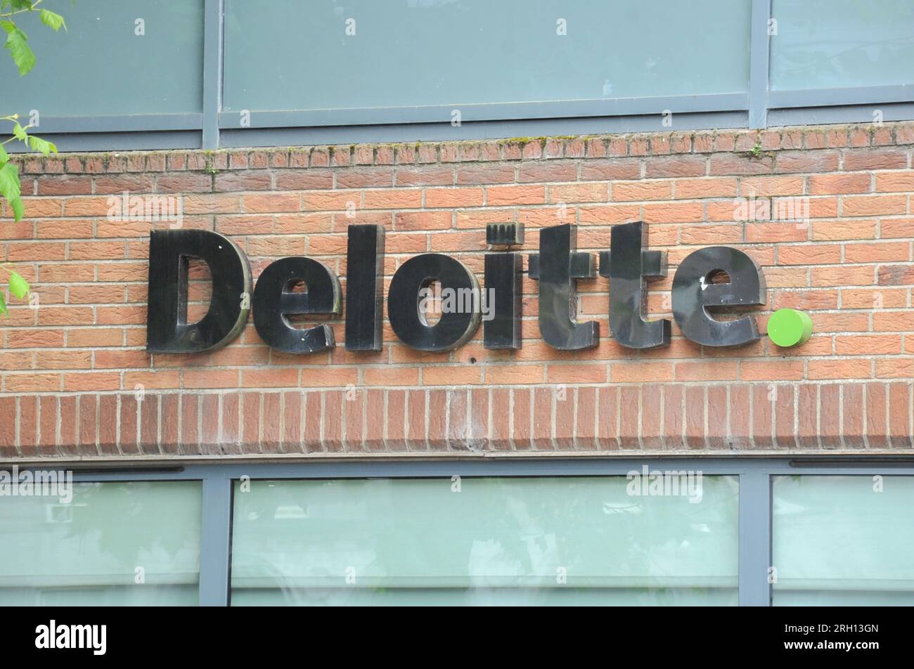 Deloitte company signage Stock Photo - Alamy