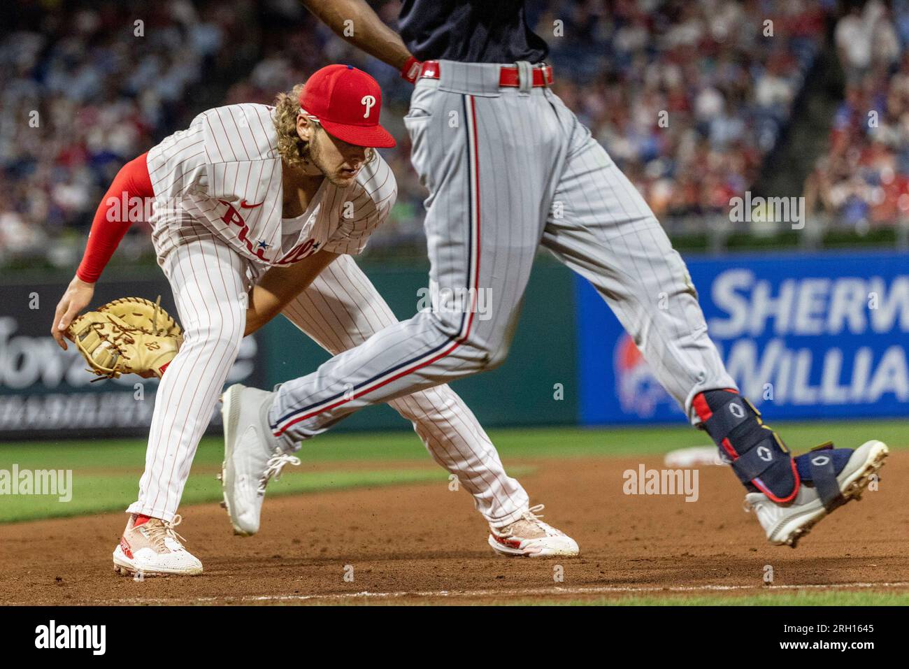 Minnesota Twins' Michael A. Taylor, right, is out at first after ...
