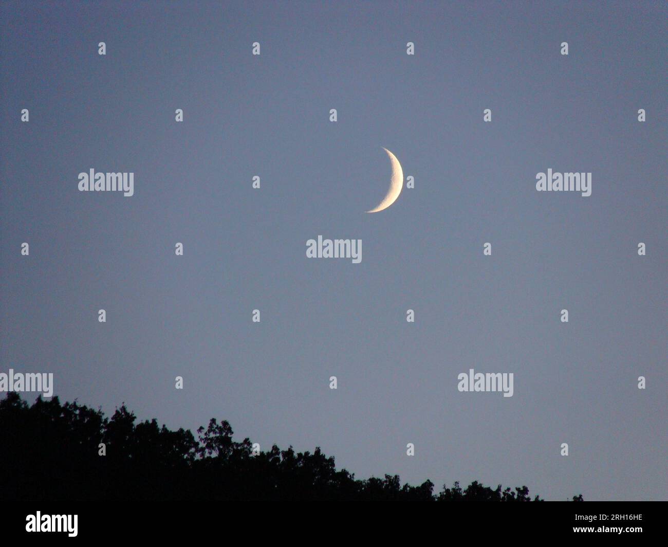 Crescent Moon Over Lake at Twilight Stock Photo - Alamy